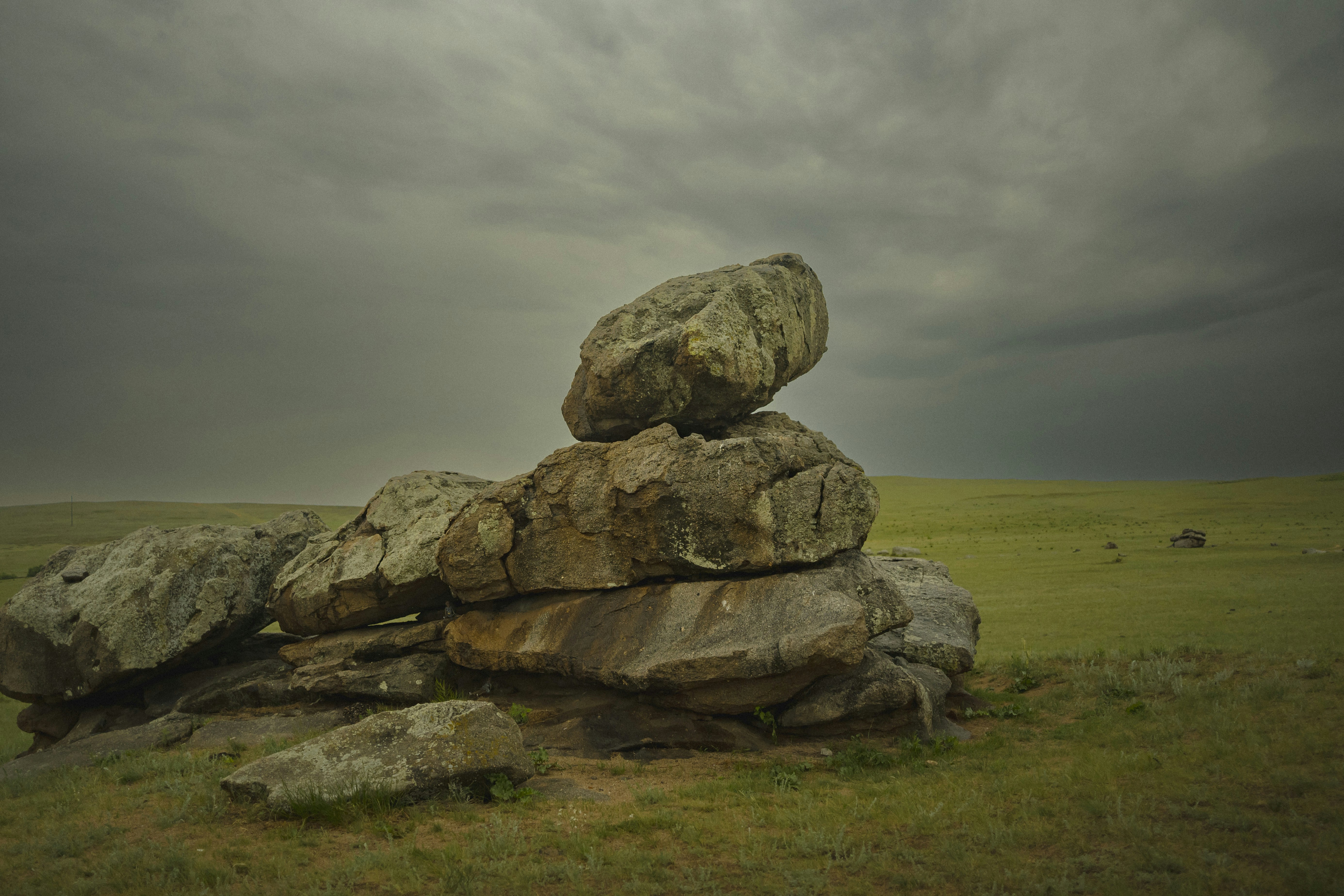 Balanced Sentinel: A Stone Stack Under Brooding Skies