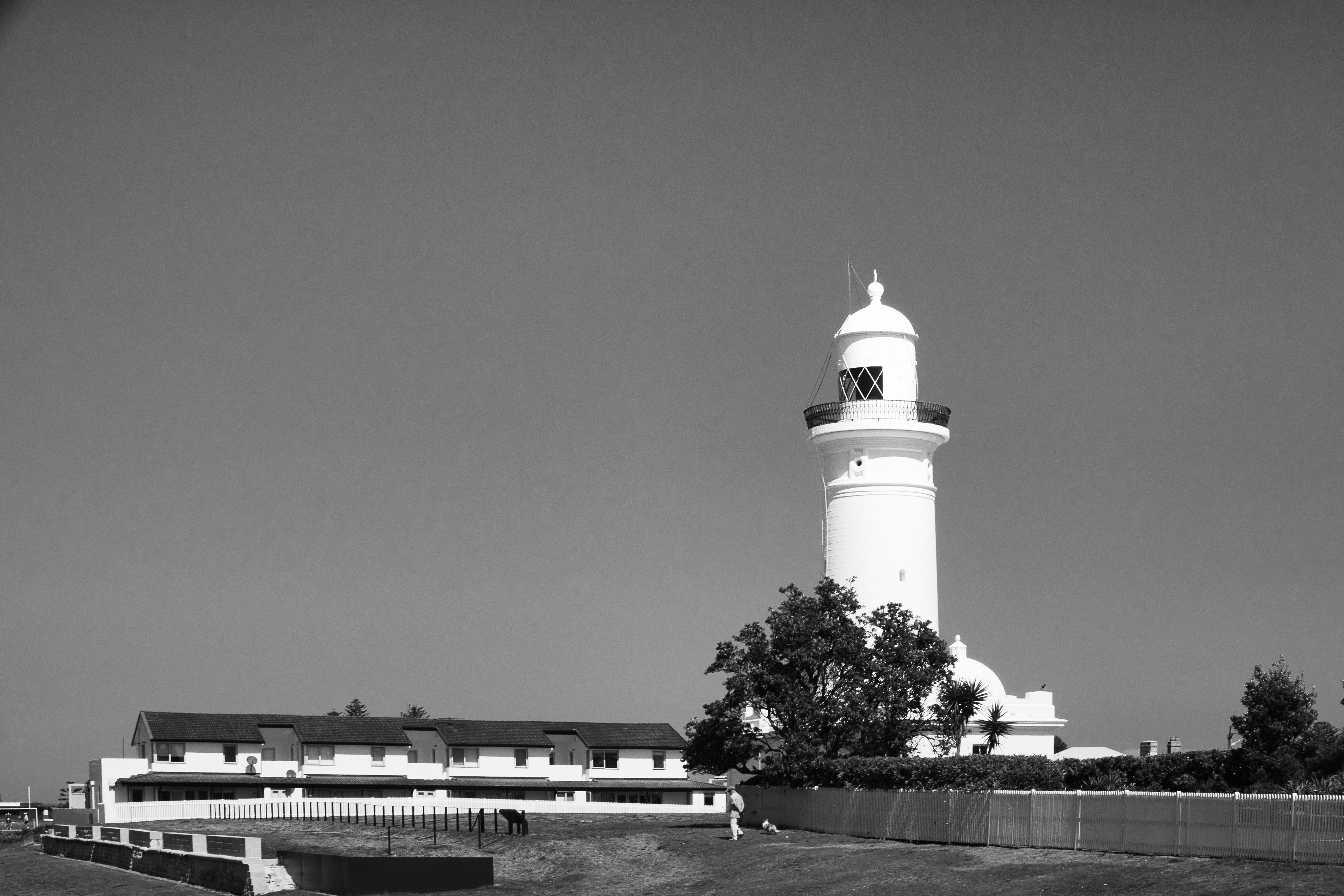 Lighthouse Sentinel: A Quiet Coastal Portrait in Monochrome