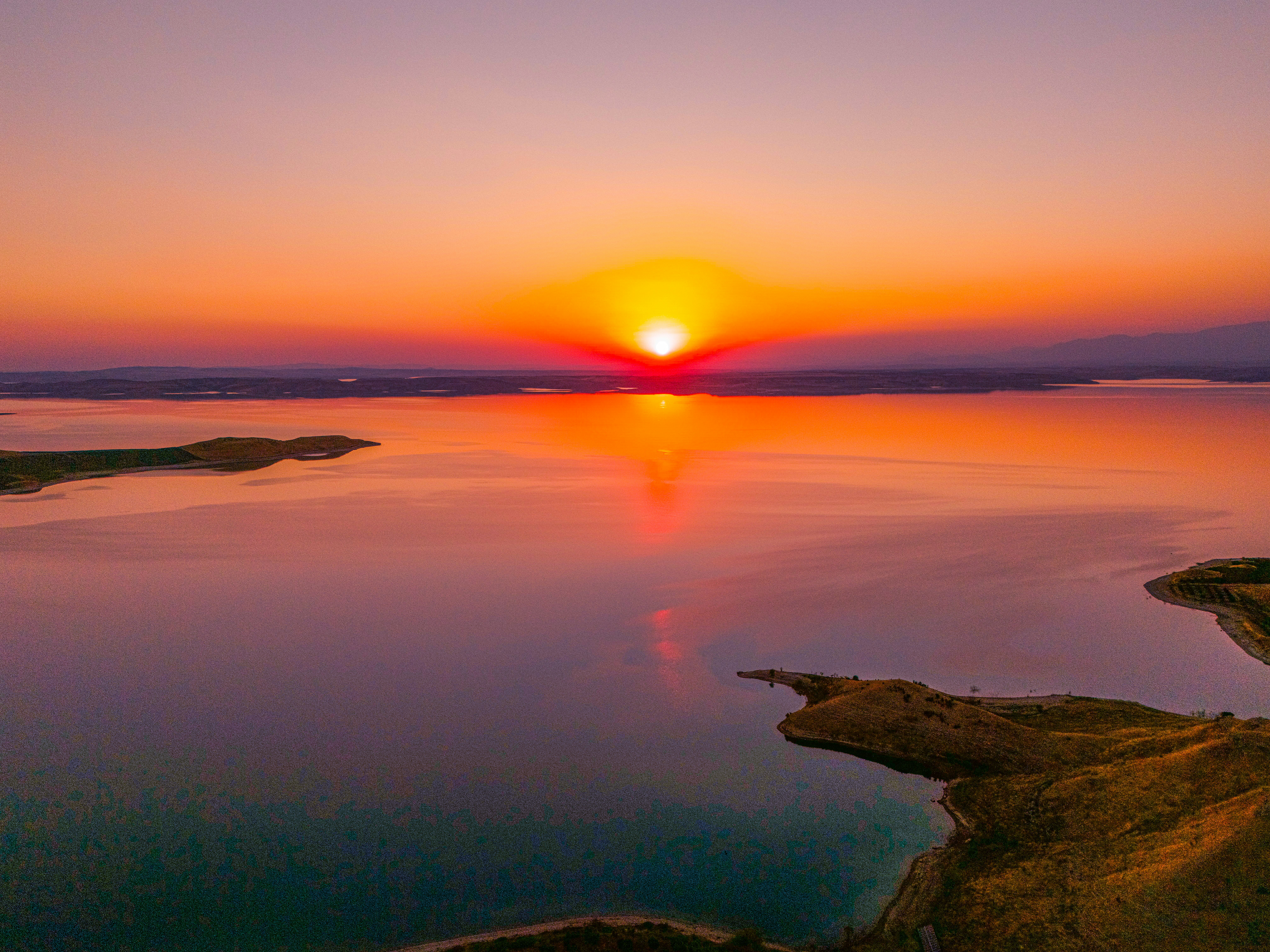 Sunlit Confluence: A Quiet Sunset Over Tidal Embayment