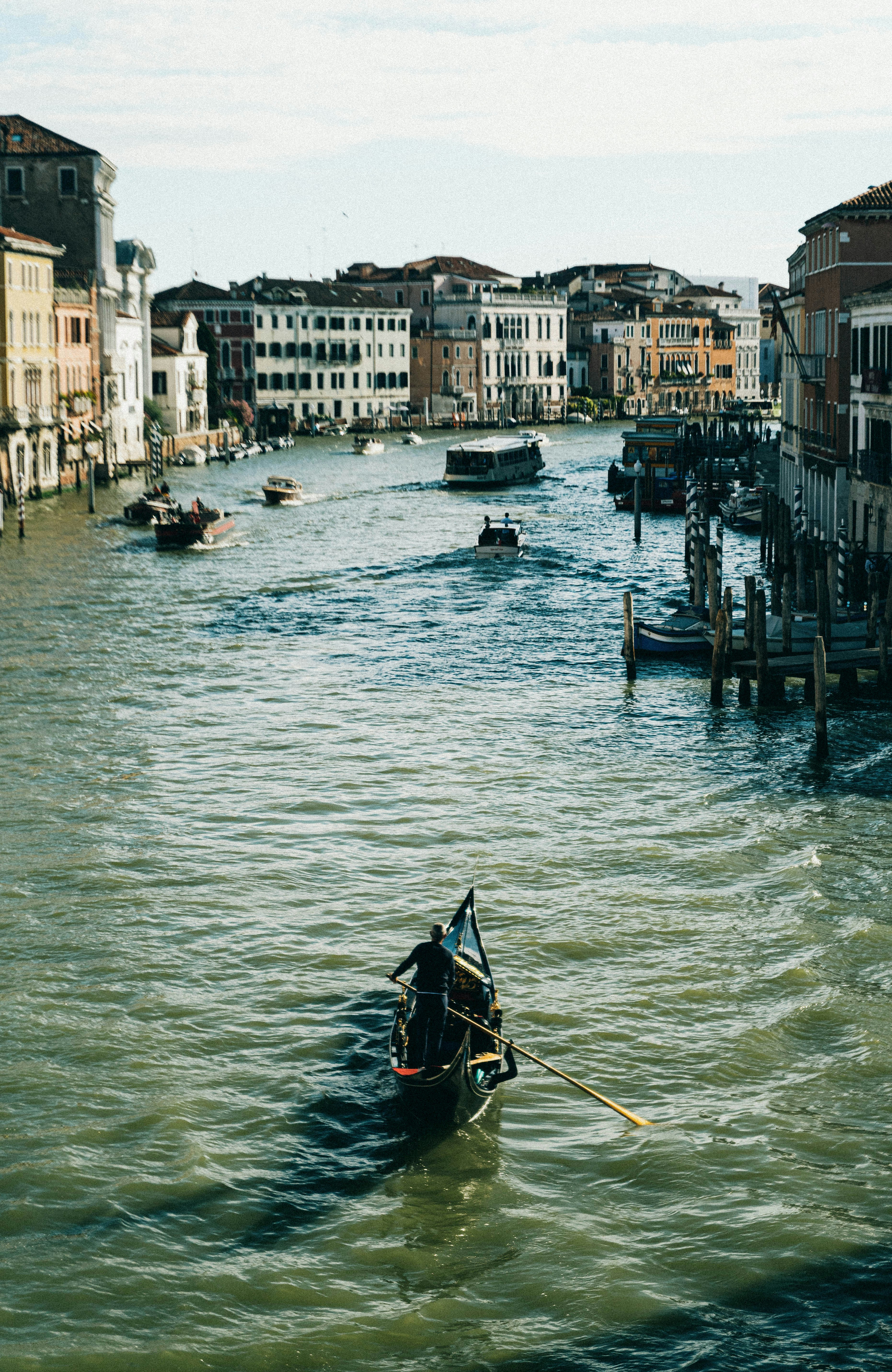 Gondola Glide Through a Venetian Channel at Dusk