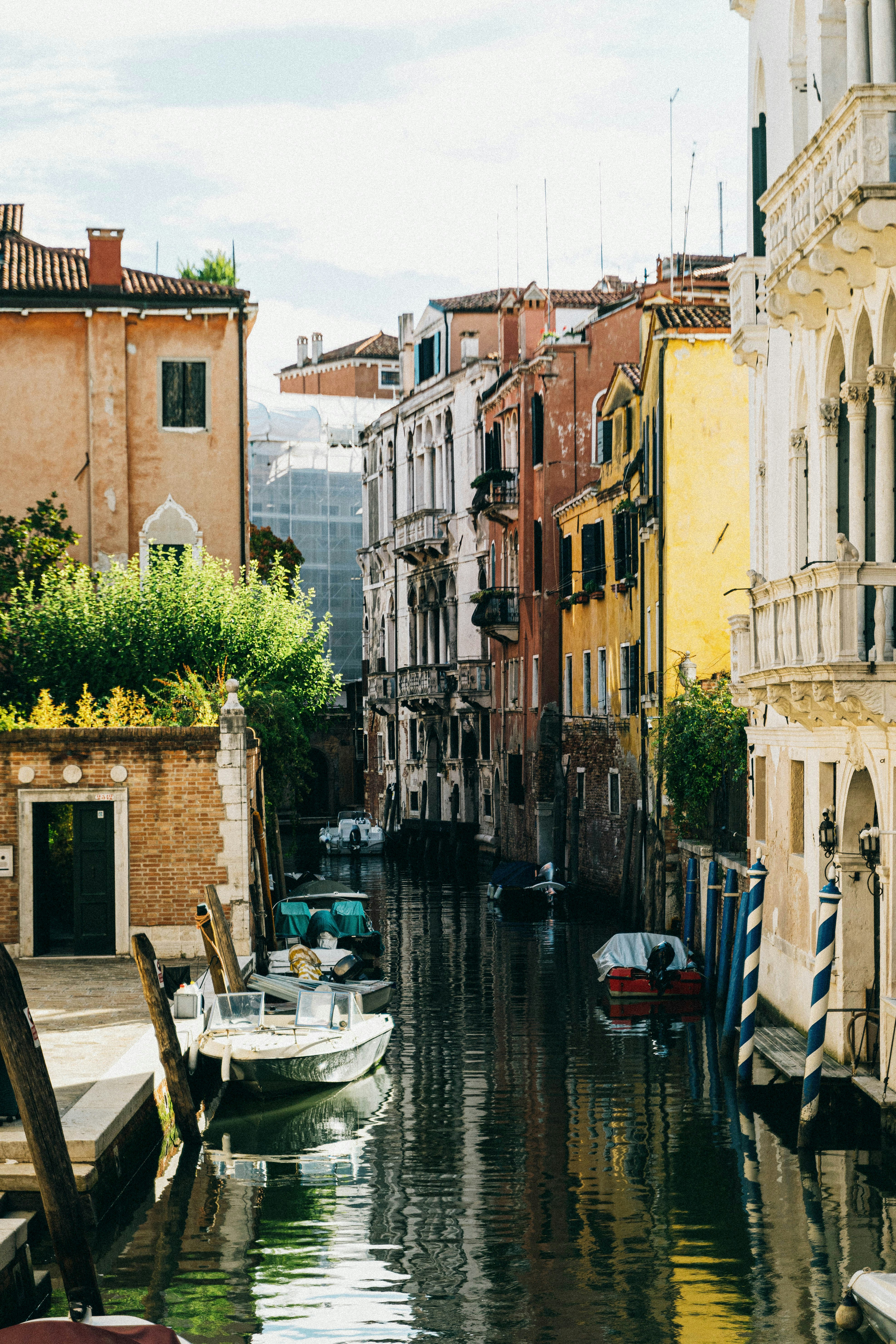 Canal Courtyard: Sunlit Facades and Reflections in a Venetian-Style Waterway