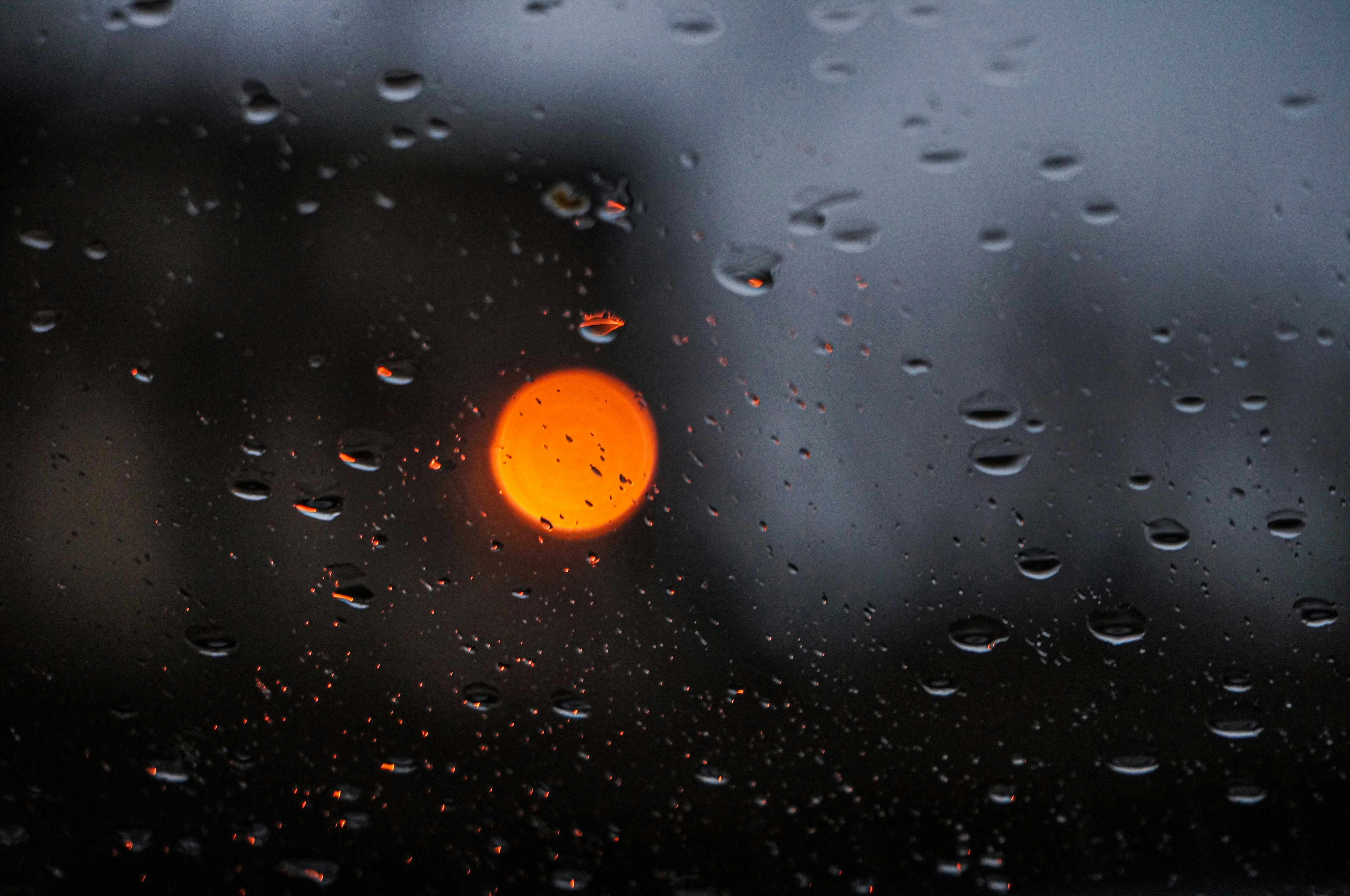 Infrared glow through rain-kissed glass at twilight
