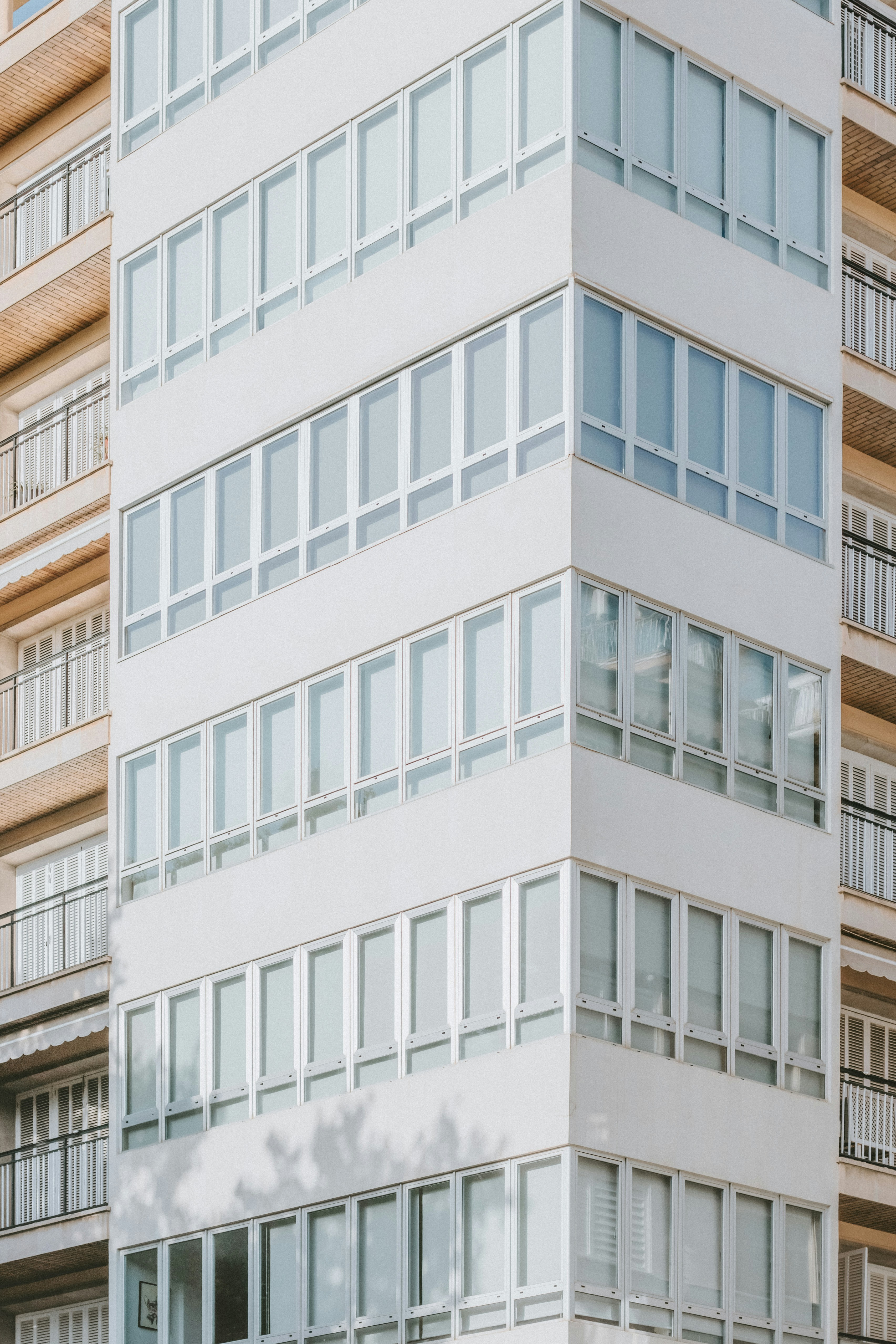 Beacons of Geometry: Sunlit Facade of a Modern Block