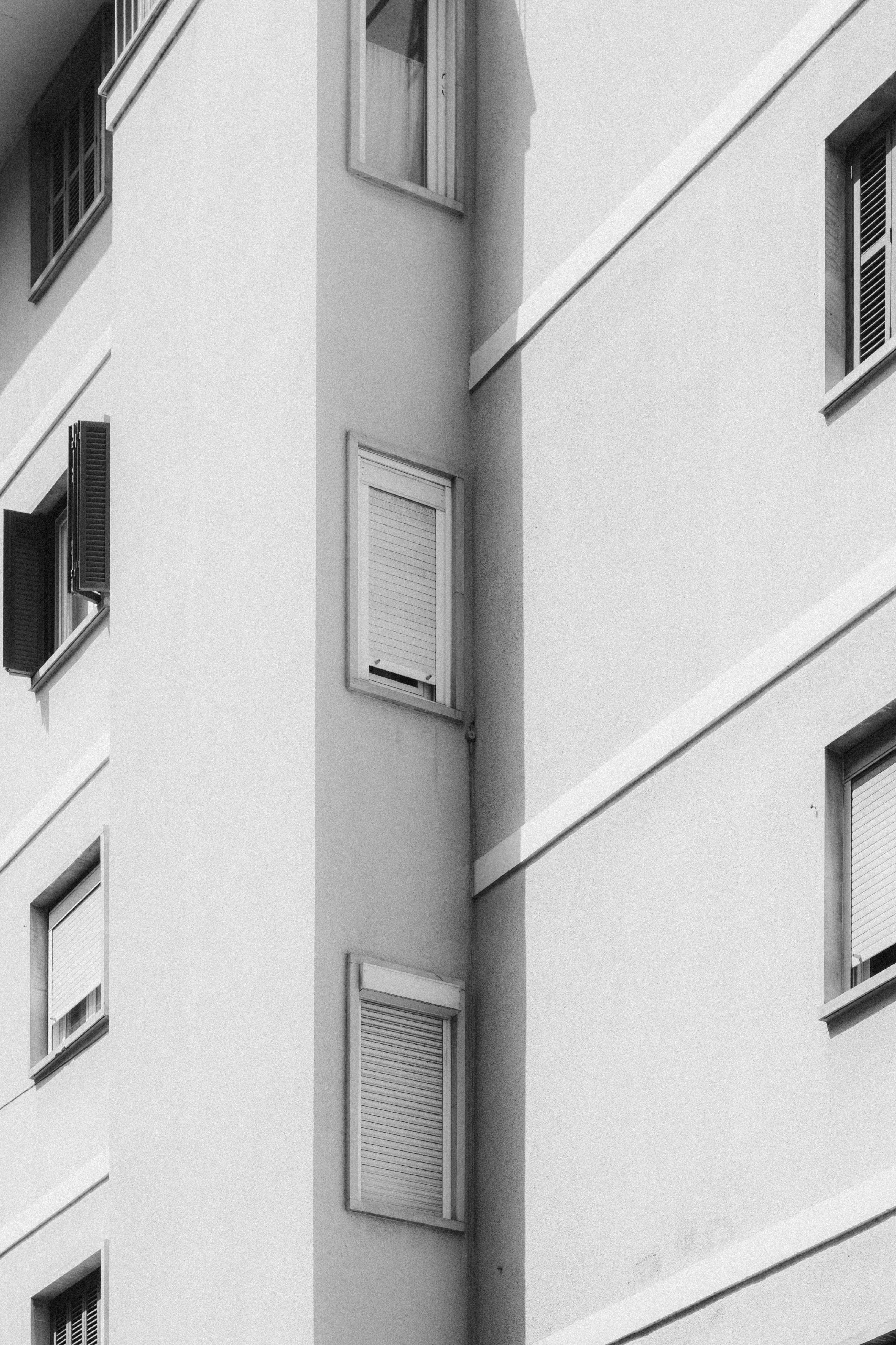 Concrete Facade Geometry: Vertical Stripes and Shuttered Windows