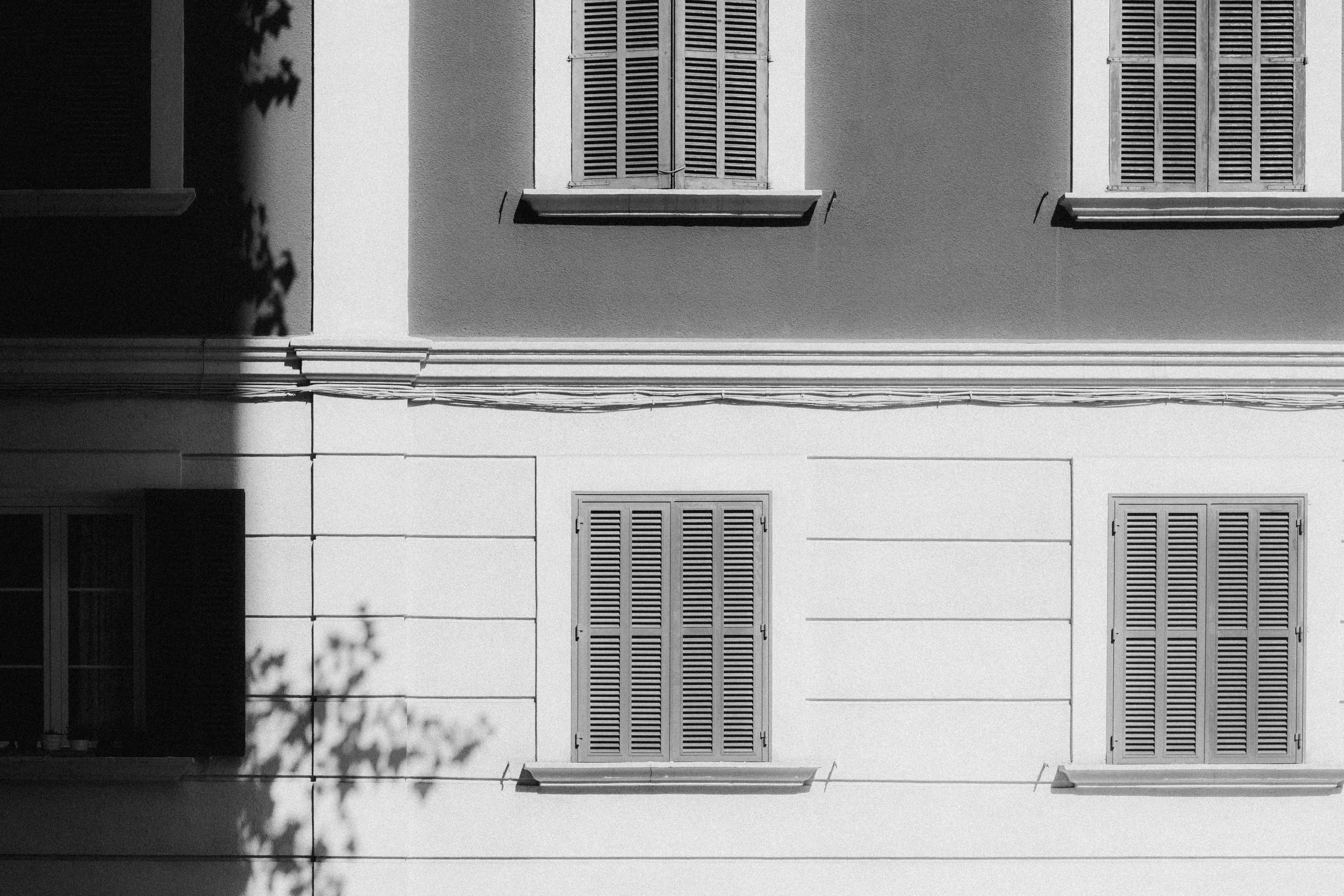 Sunlit Facade Notes: Shuttered Windows in High Contrast