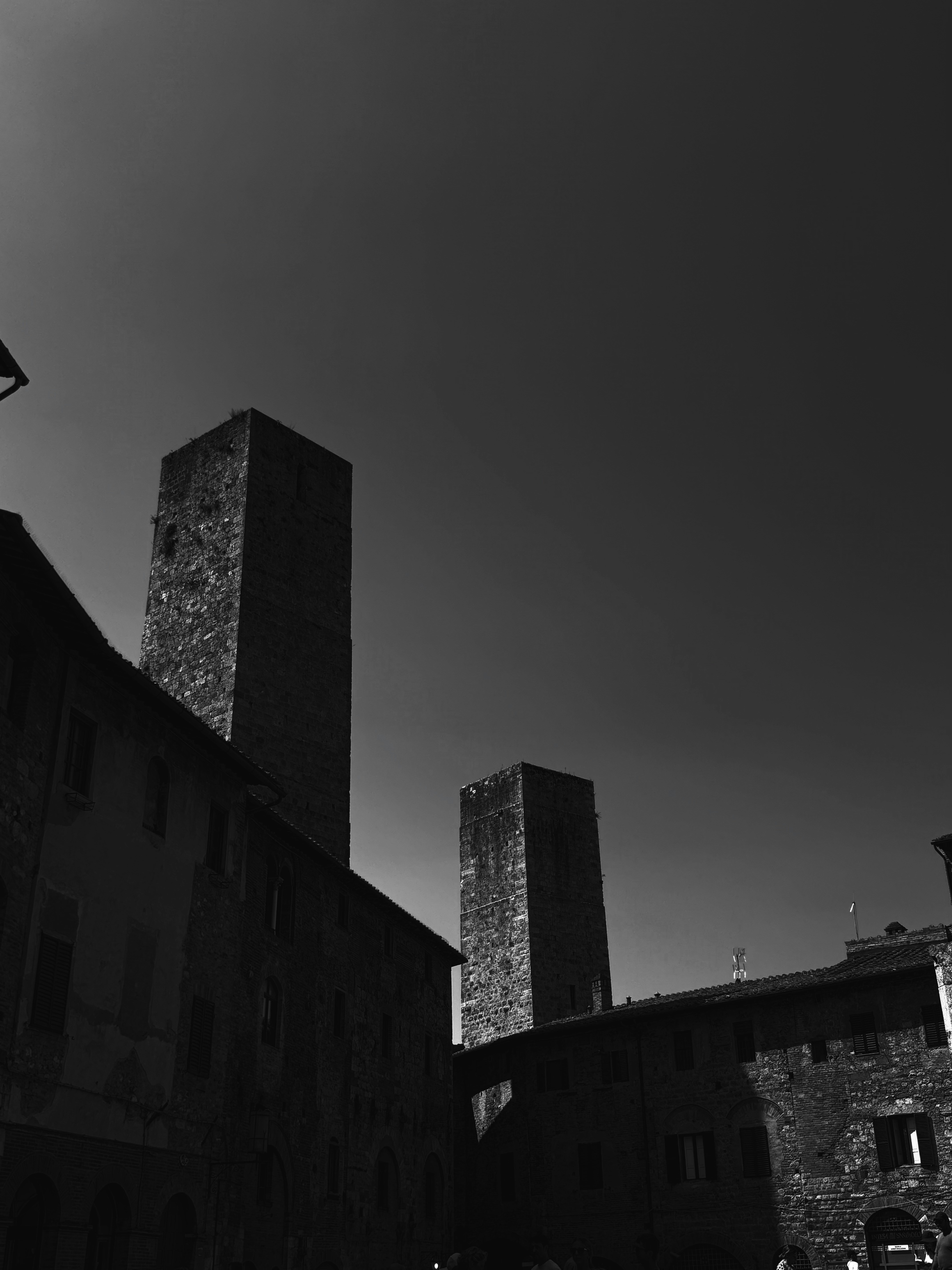 Towered Shadows Over Aged Facades at Dusk