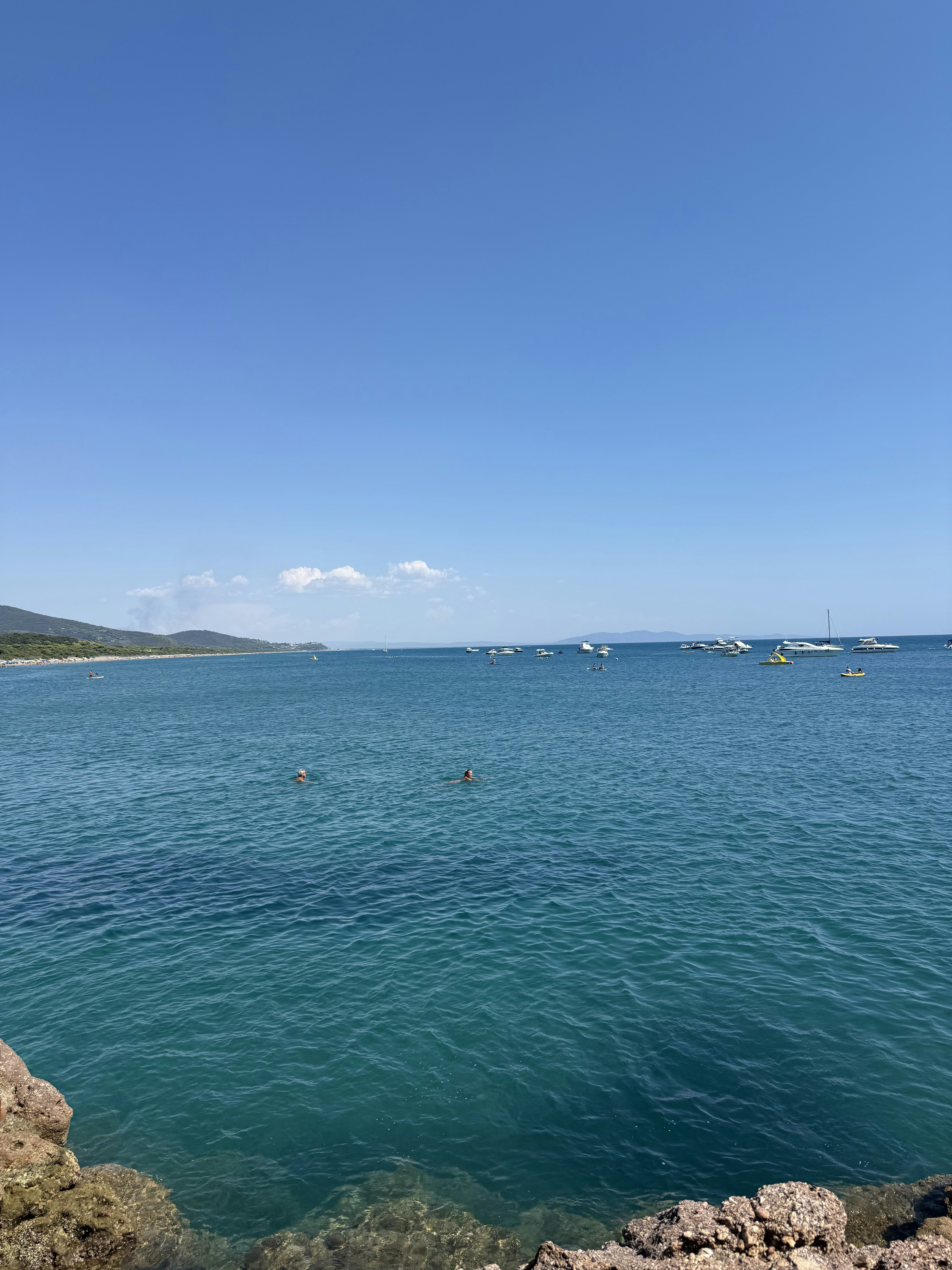 Azure Horizon: Boats at Rest on a Quiet Sea