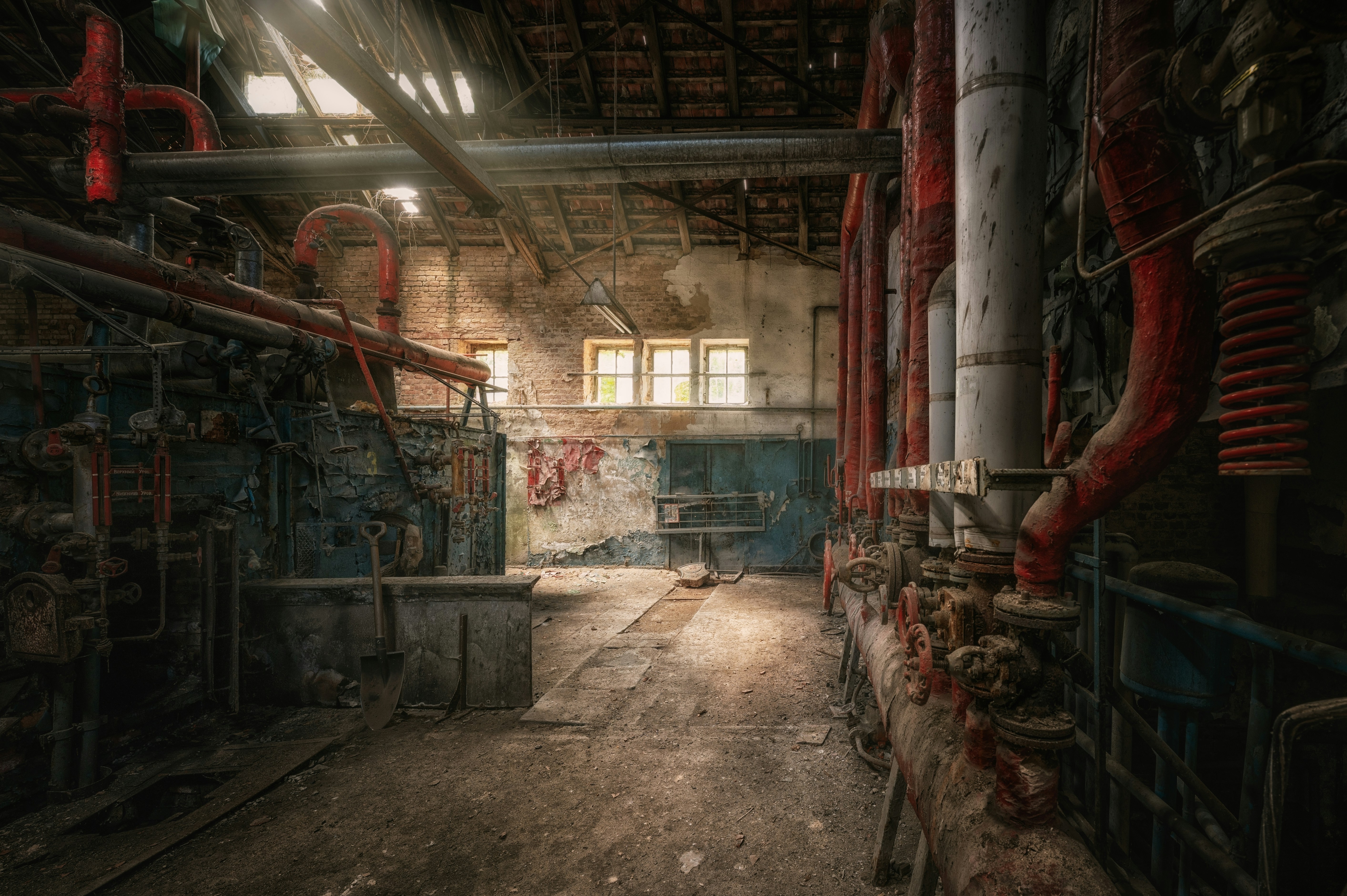 Sunlit Break in the Boiler Room: A Quiet Glimpse Through Dust and Pipes