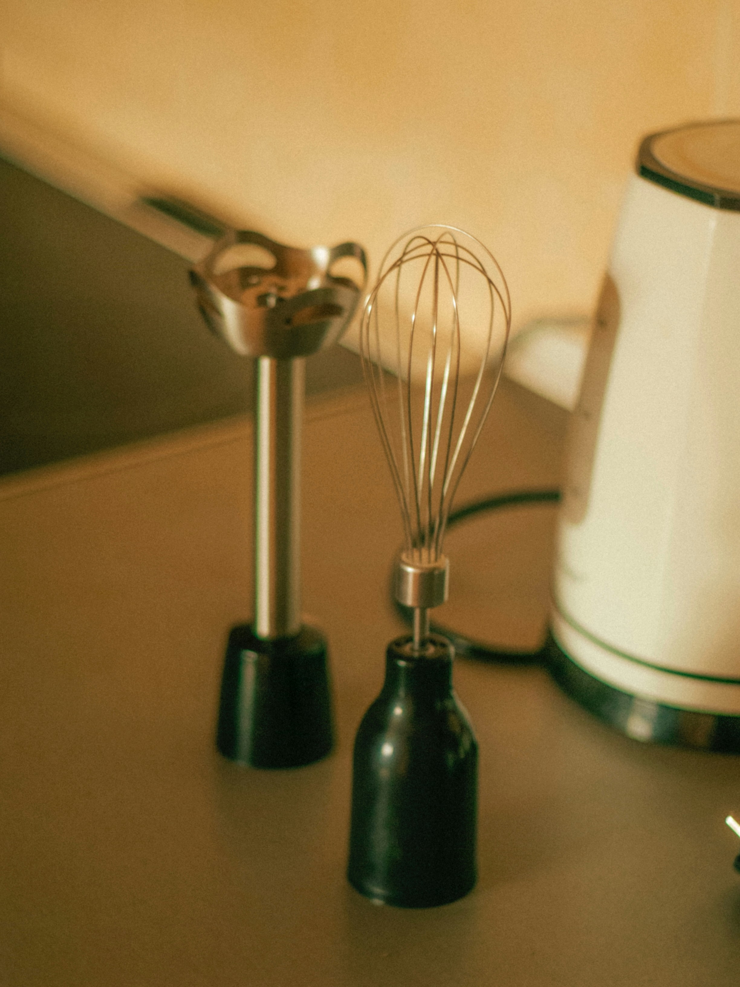 A Kitchen Whisk in Focus: Quiet Tools on a Warm Countertop