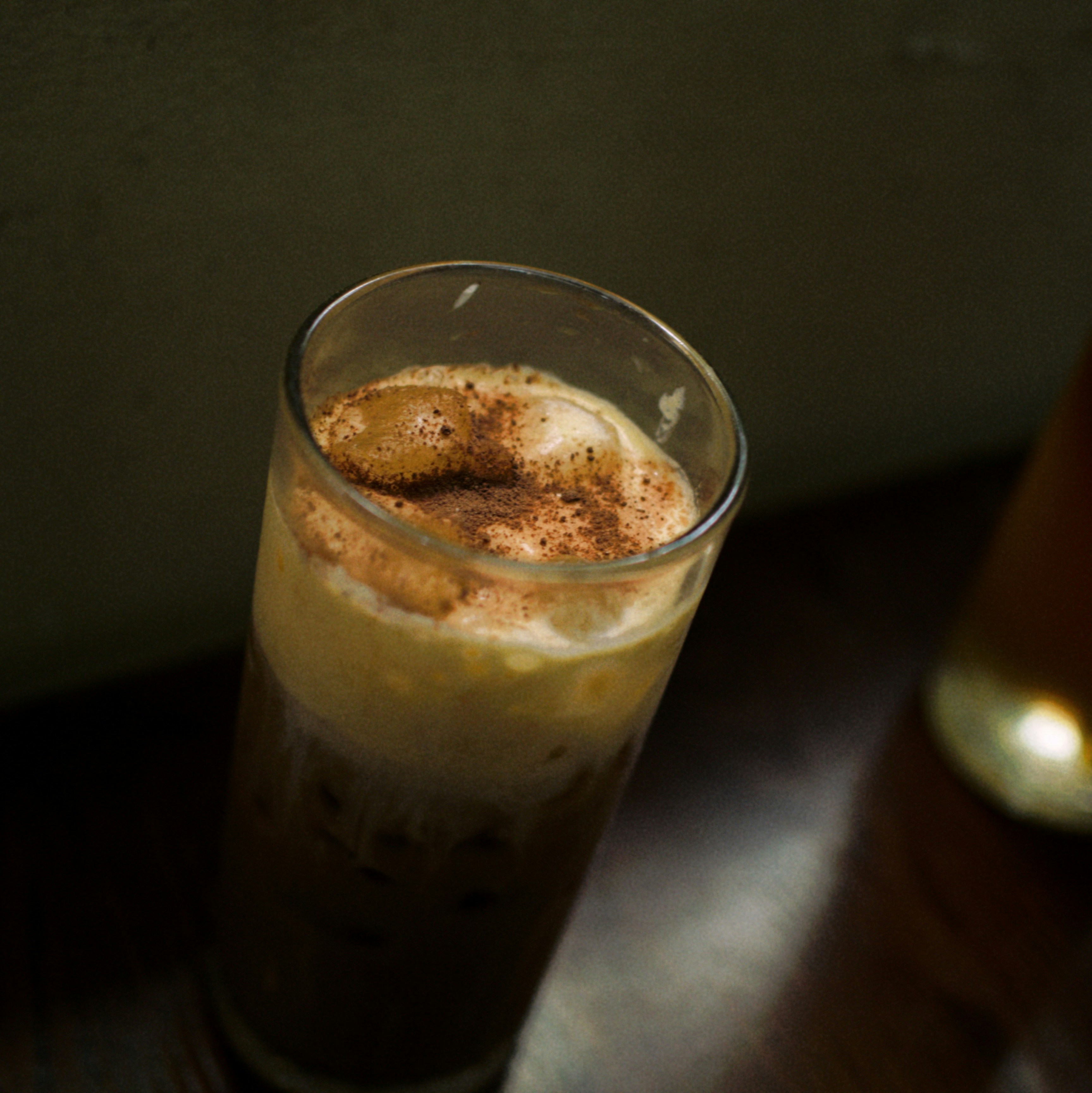 Creamy Coffee Cascade in a Tall Glass with Cinnamon Dust