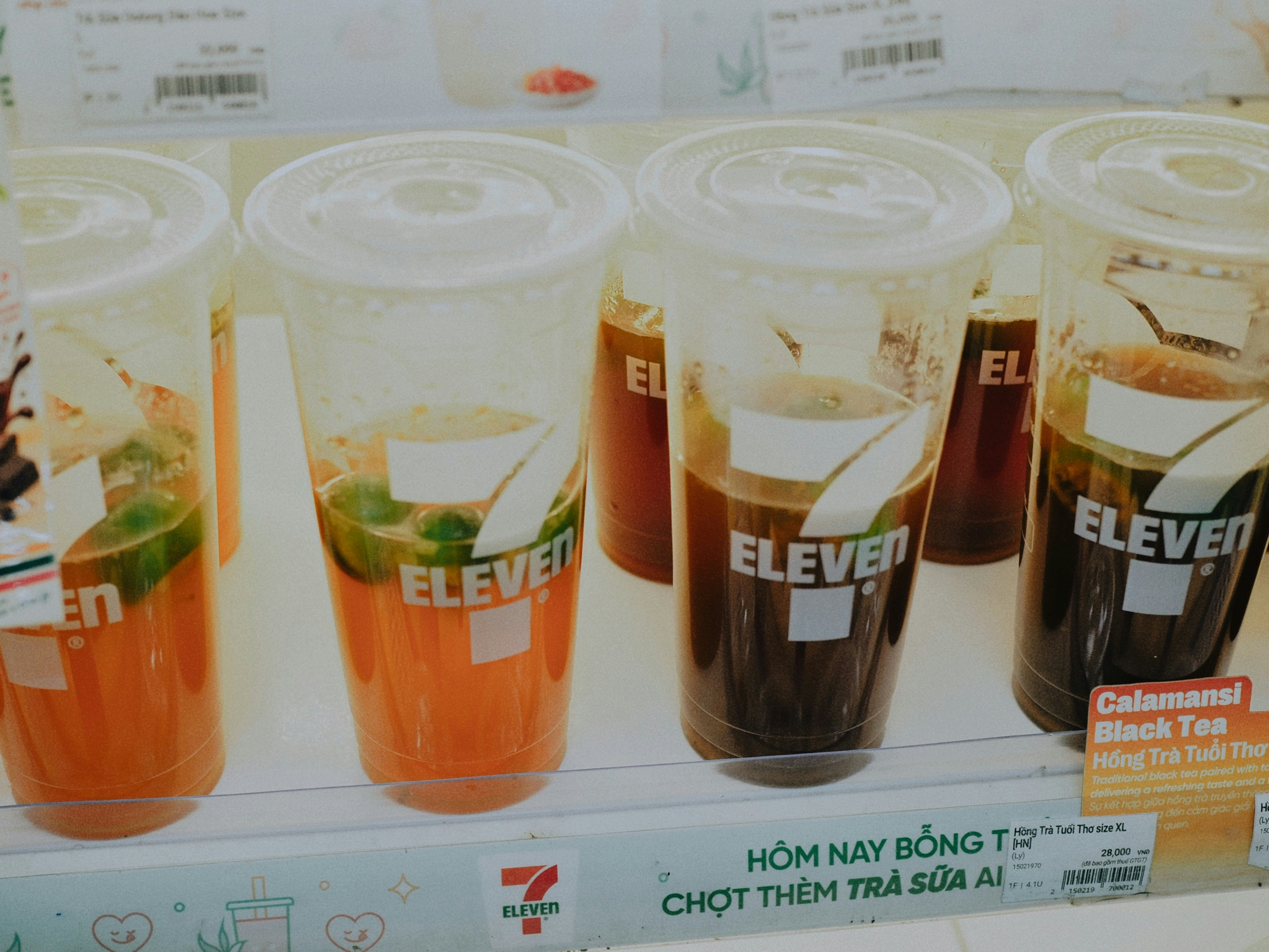 Eleven Cups of Iced Tea Standing in a Cooler Display