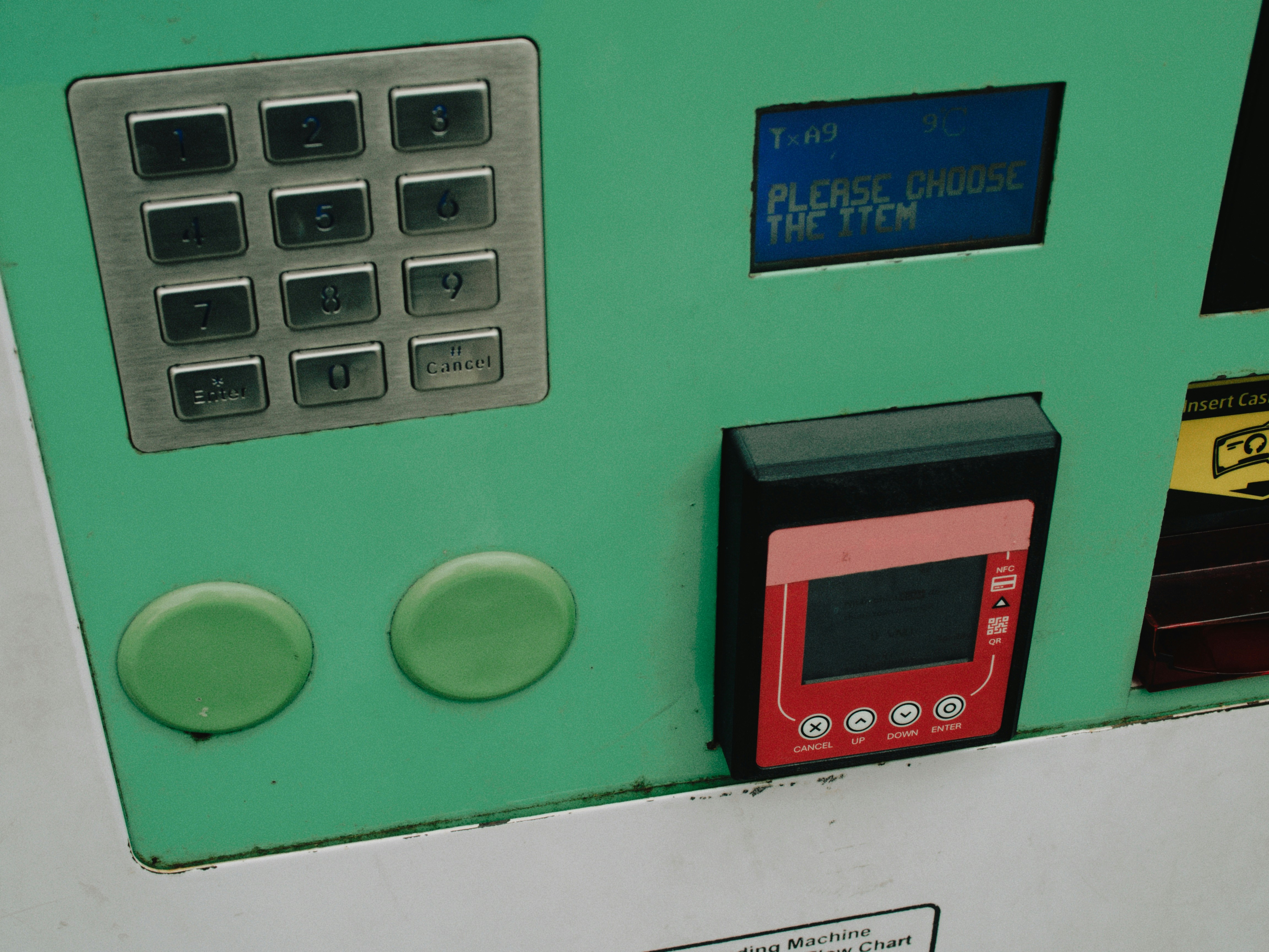 Tap to Pay: Green Public Transit Card Reader in a Cluttered Panel