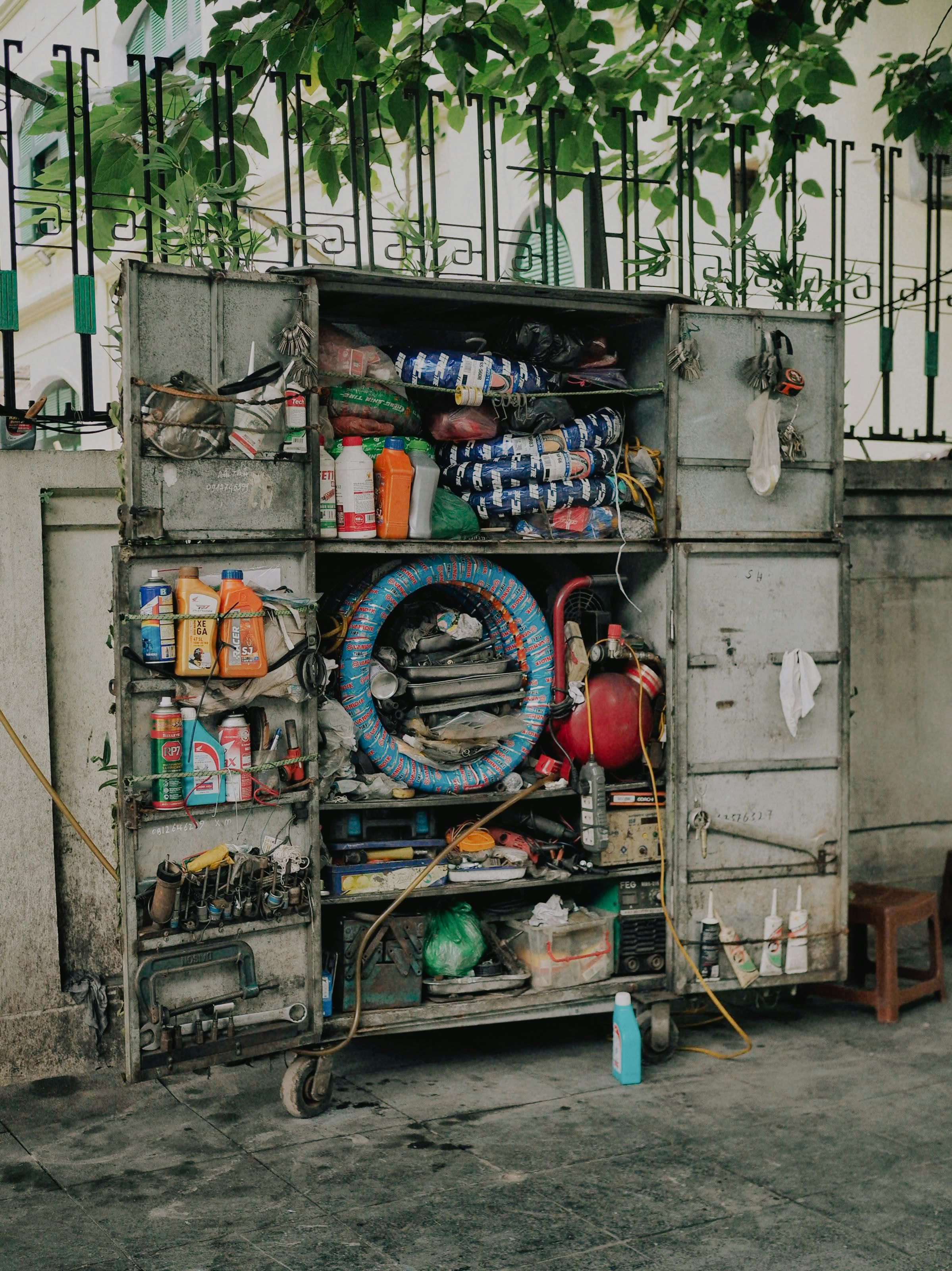 Urban Hardware: a Tangle of Tools and Tubes in a Weathered Locker