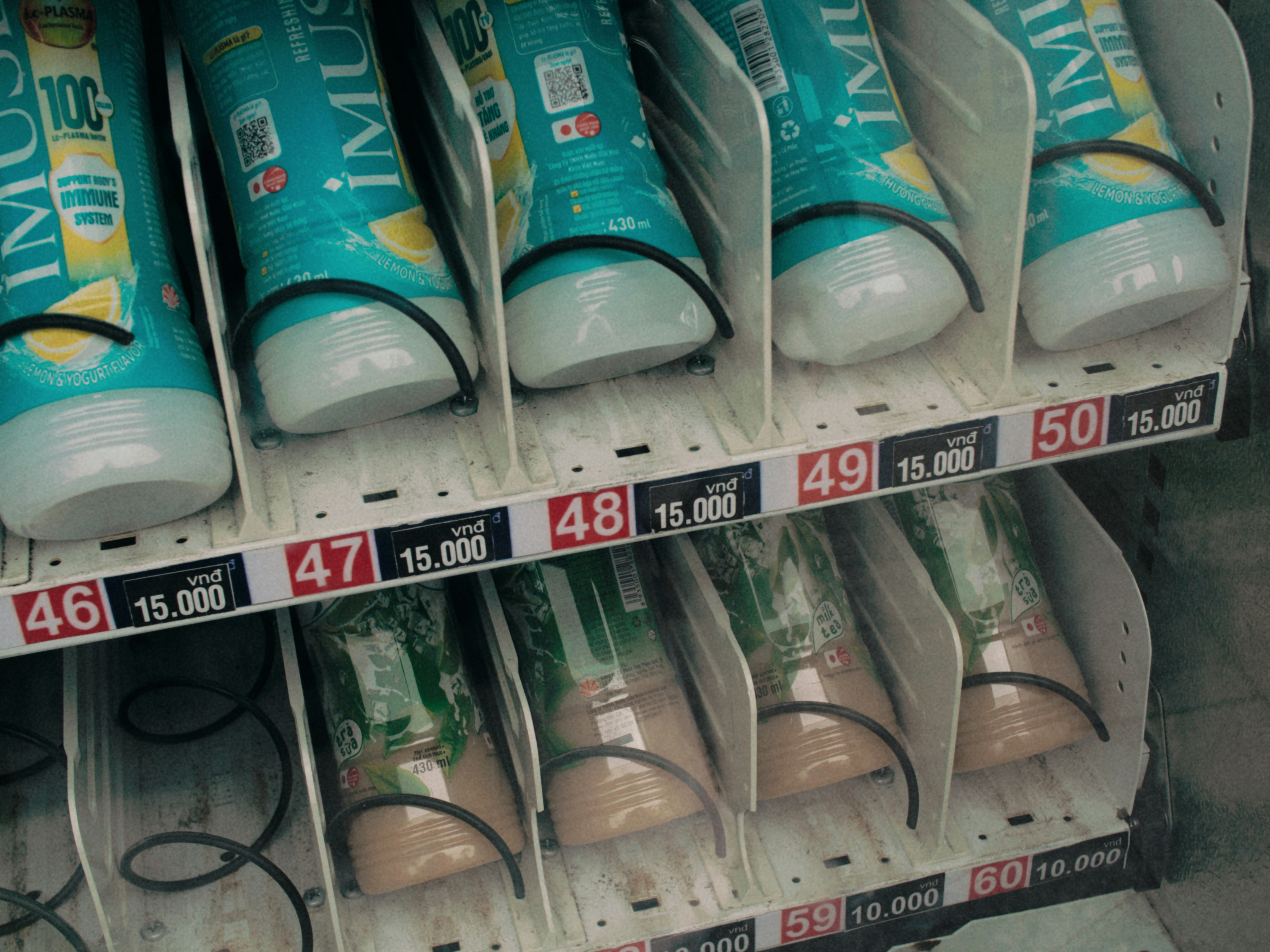 Chrome Canisters in a Narrow Aisle of Vending Racks