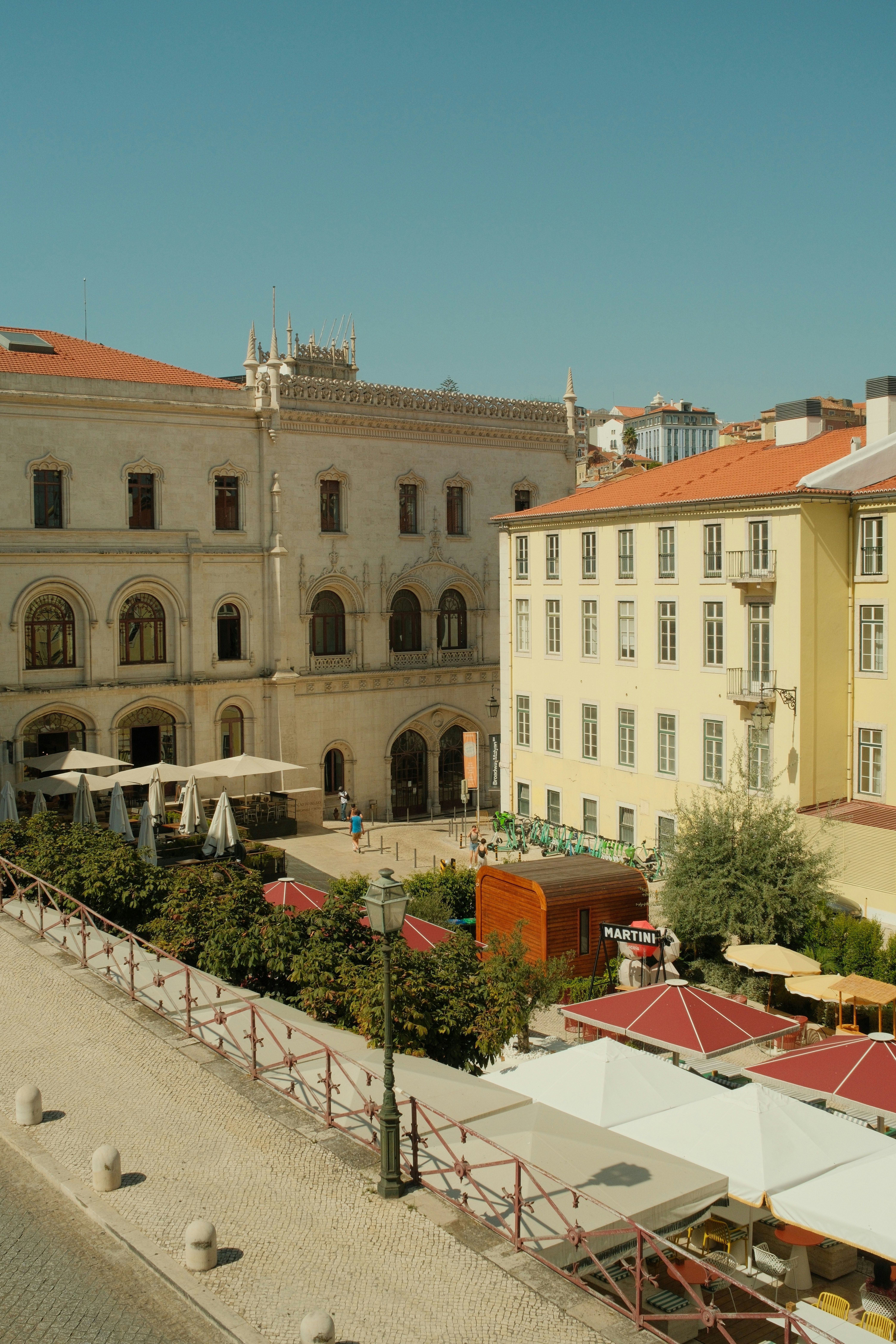 Sunlit European Plaza with Courtyard Café Afloat in Warm Afternoon Light