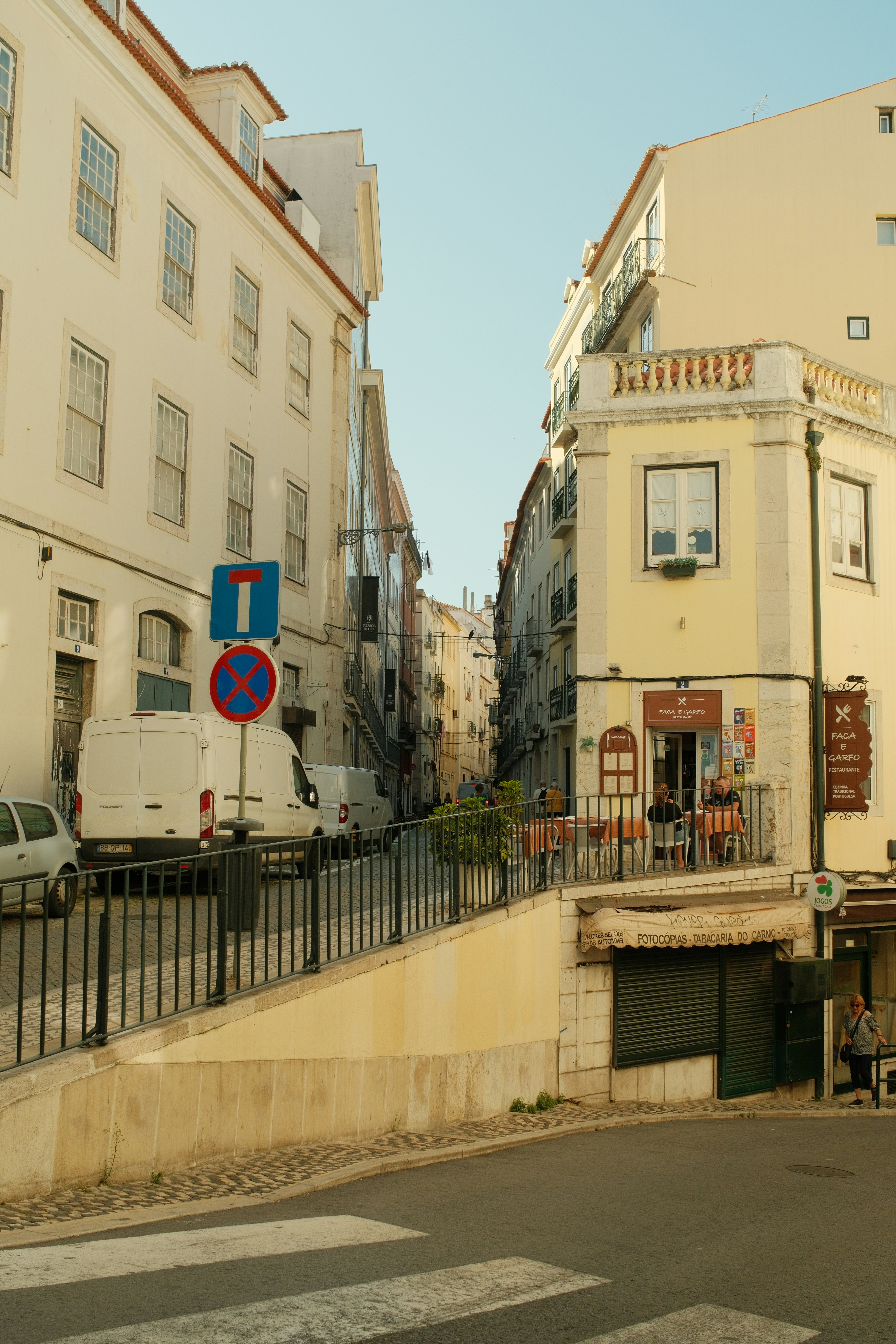Sunlit Rua: A Quiet Lane Between pastel Facades