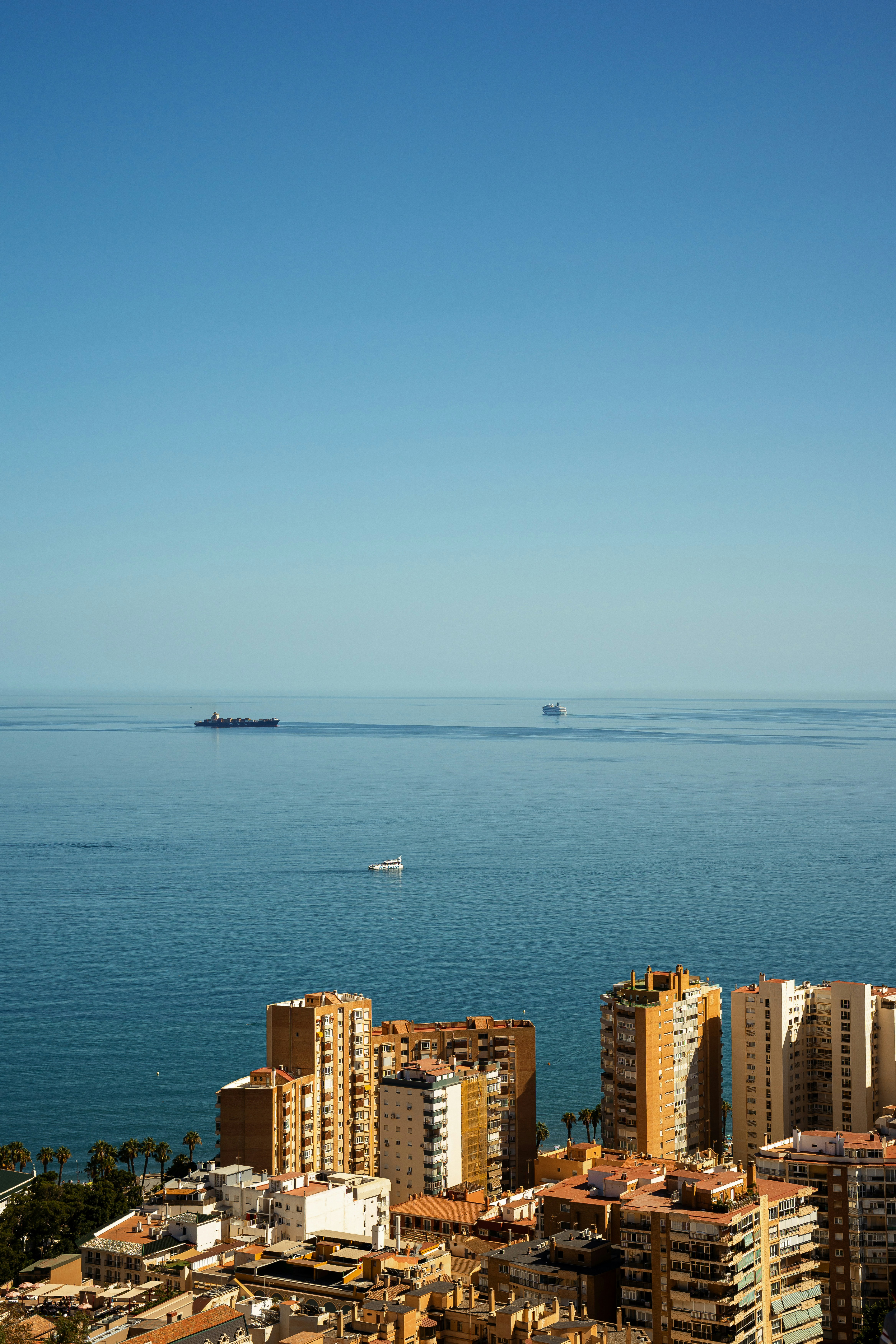 Sunlit City by the Sea: A Quiet Horizon Over Coastal Towers