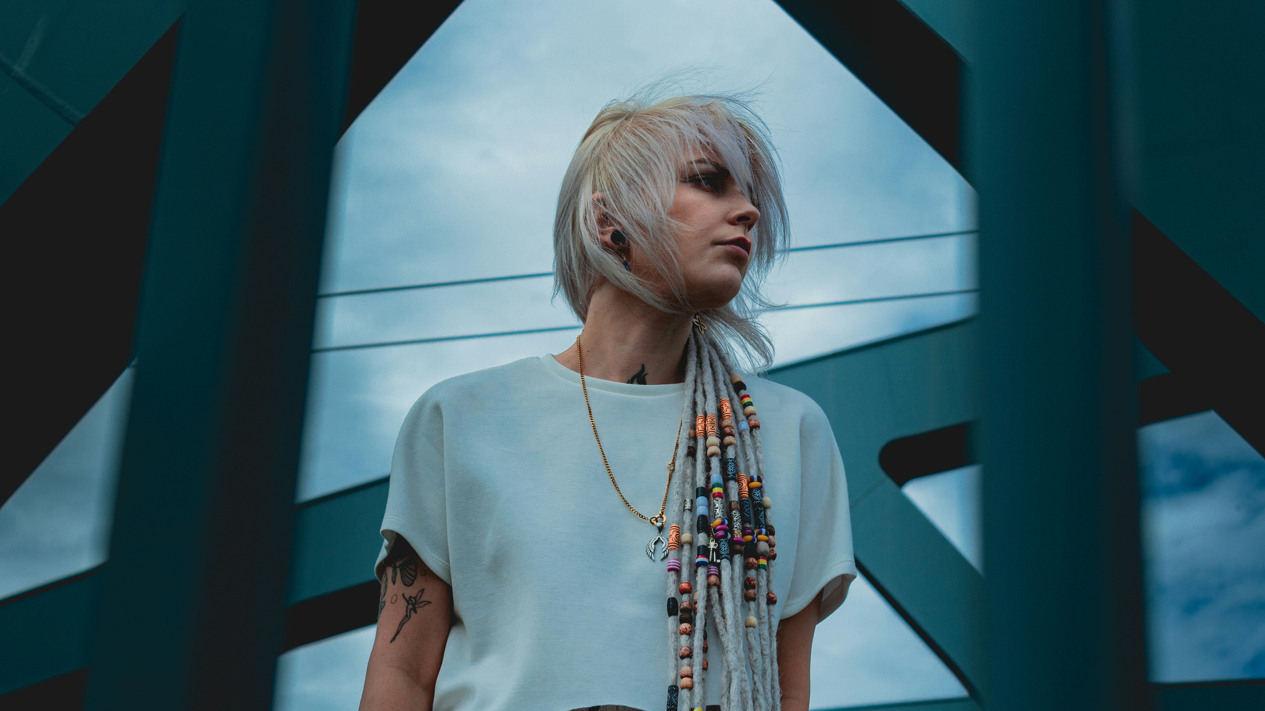 Chromatic Edge: Portrait Beneath Industrial Beams