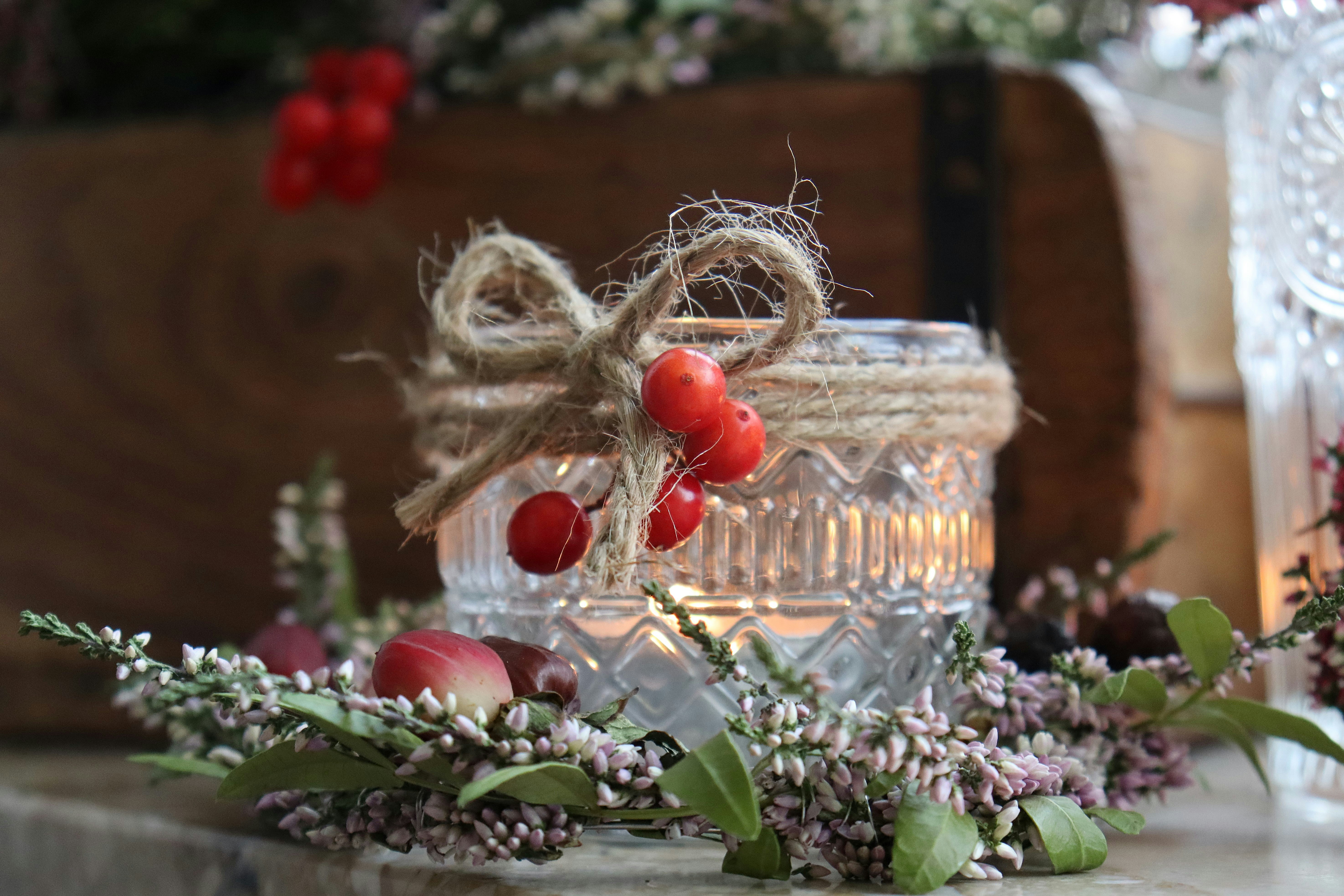Twig-Wrapped Jar centerpiece with Red Berries and Winter Flora