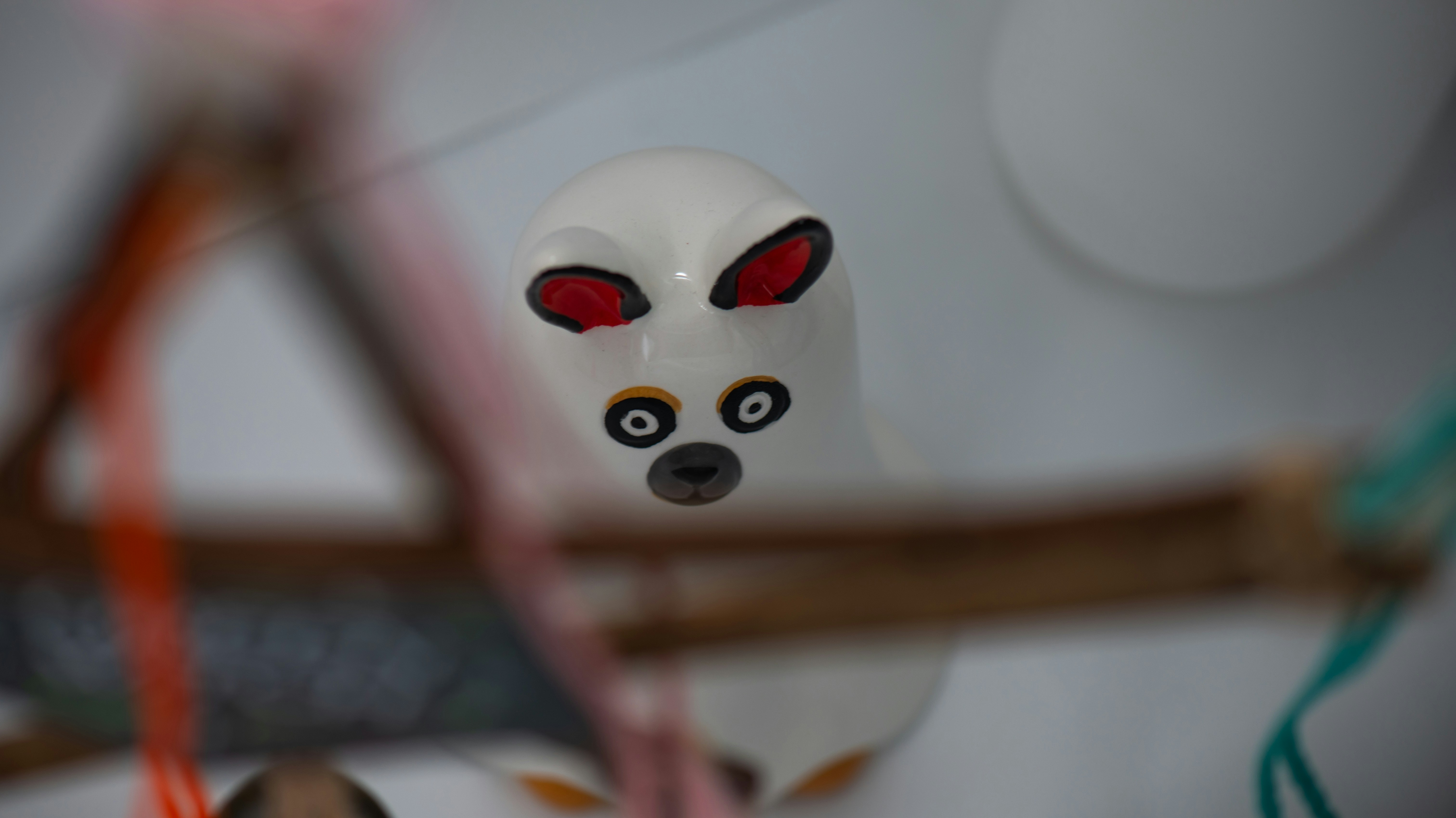 Panda Prosthetic: A Curious White Mask Peering from the Blur