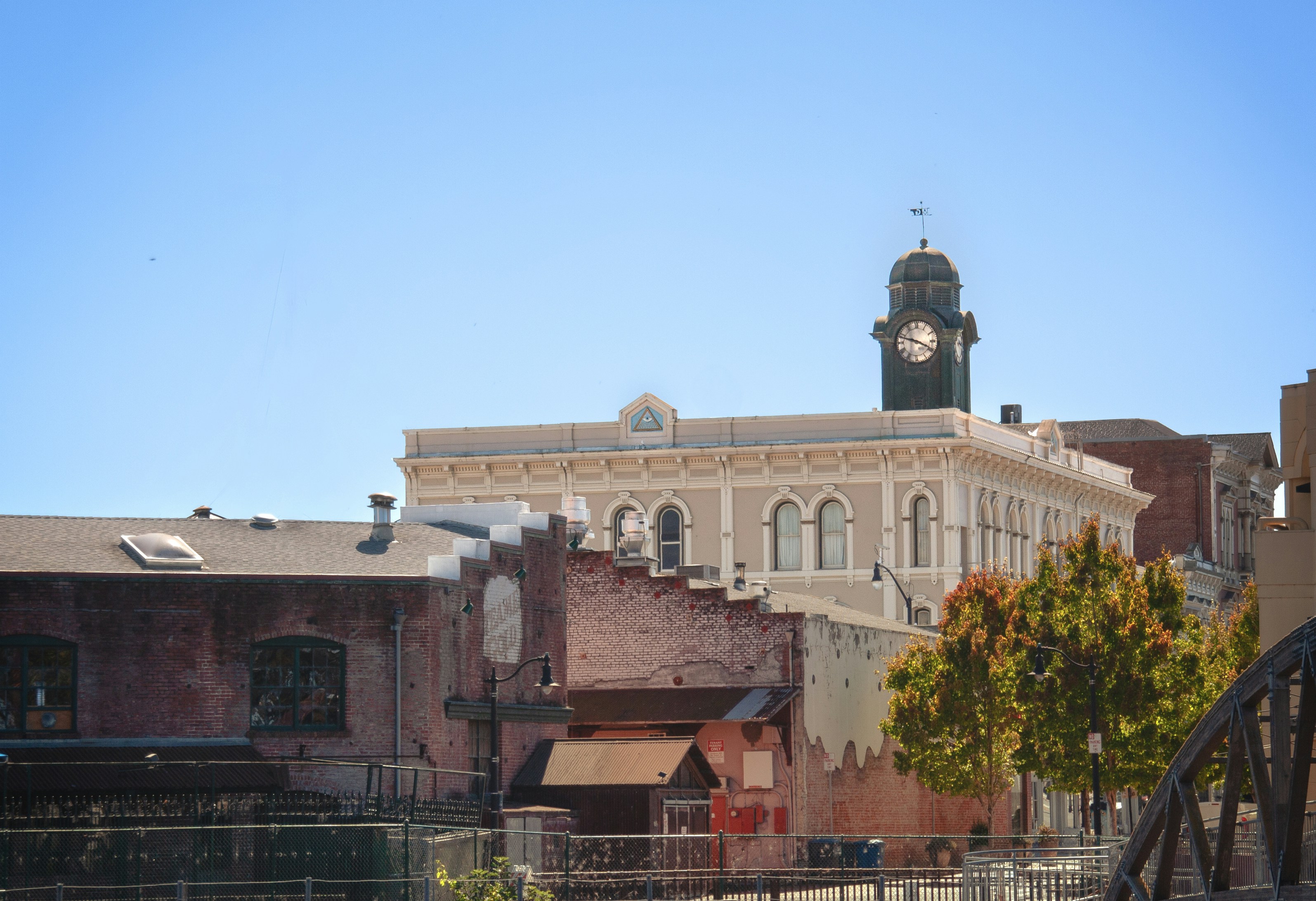 Clocktower over a sunlit urban edge