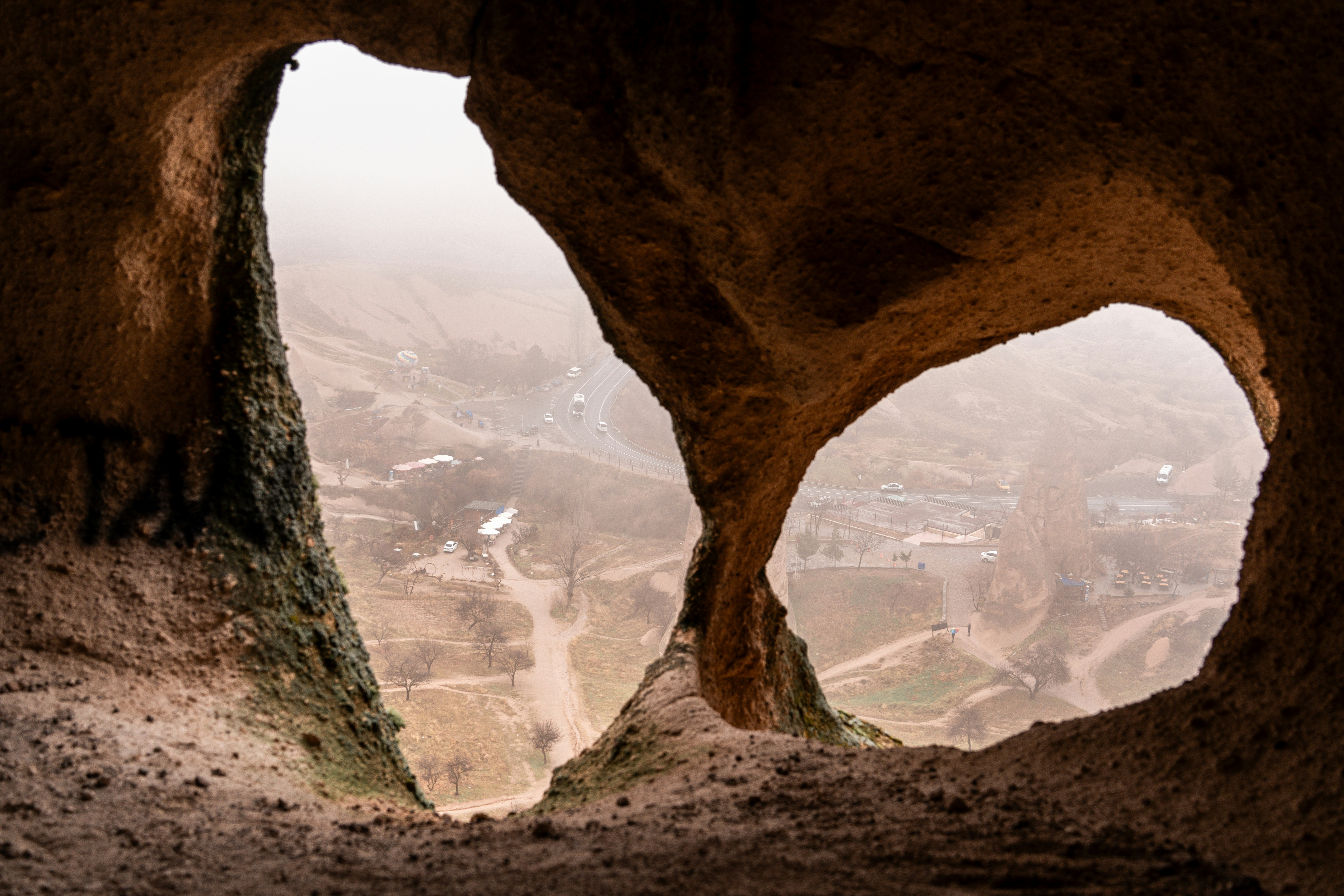 Through the Stone Arch: Valley Fogs framed by a cave window