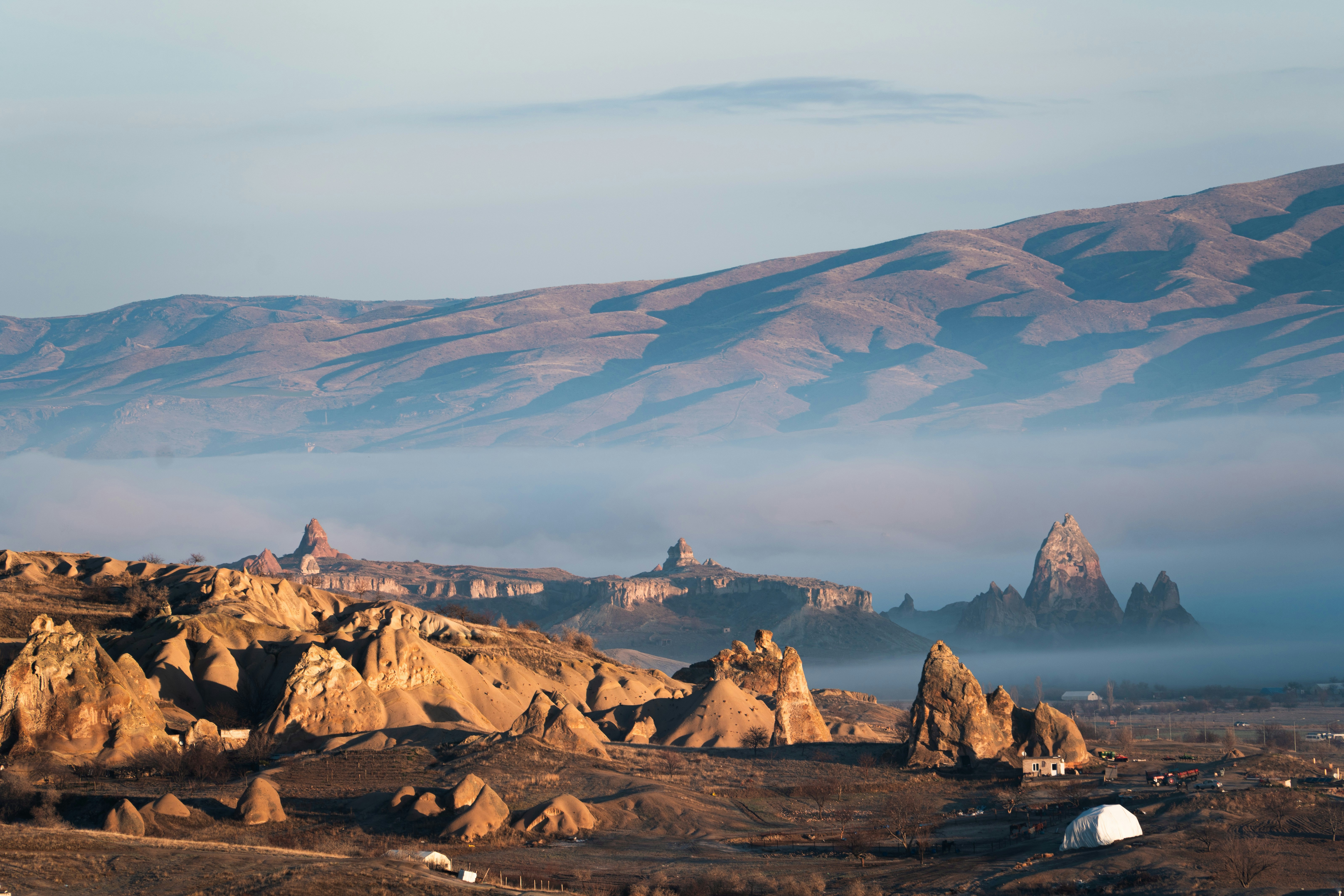 Rugged Basalt Cliffs Beneath a Mist-Softened Horizon