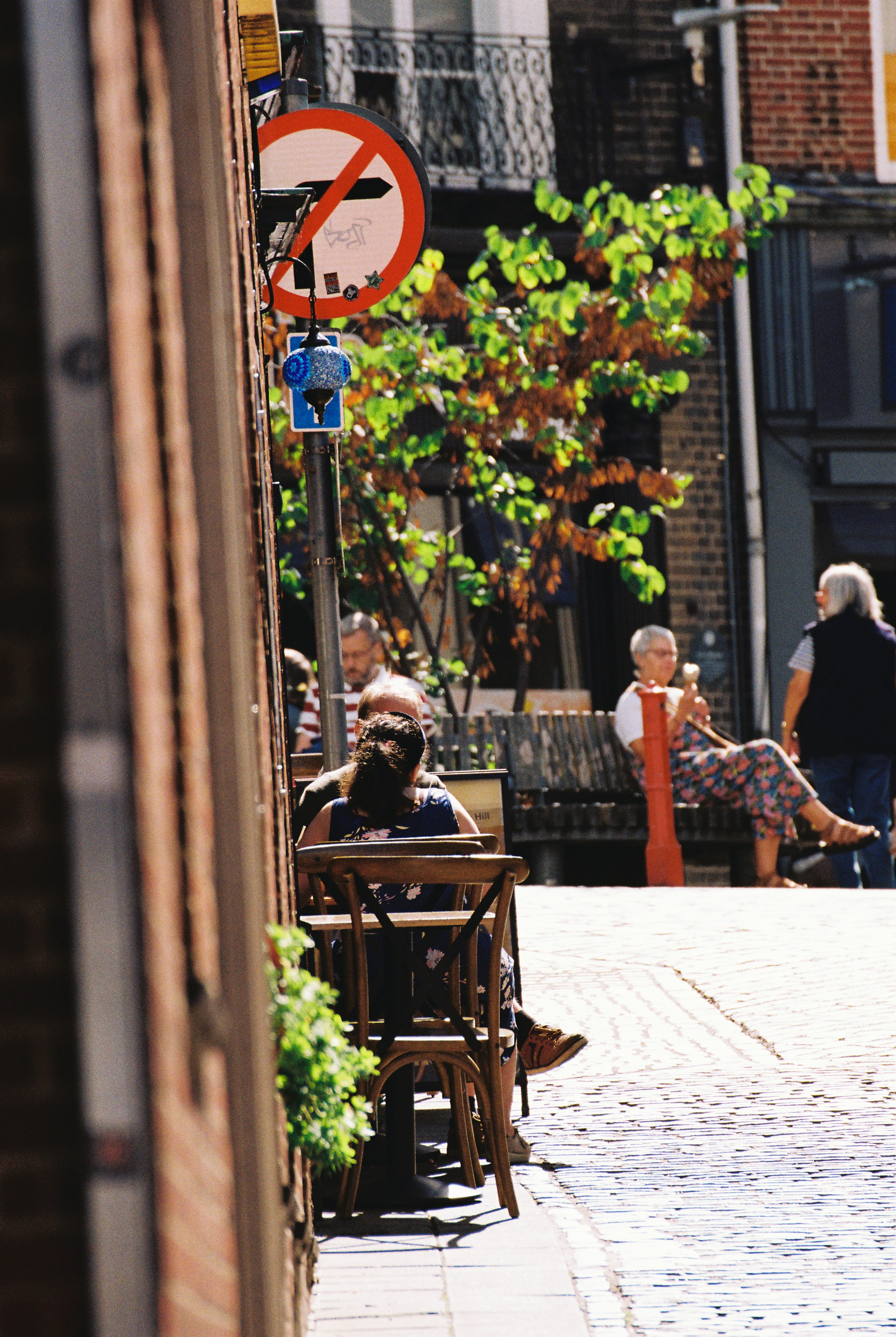 Sunlit Café Corner: A Quiet Street Portrait