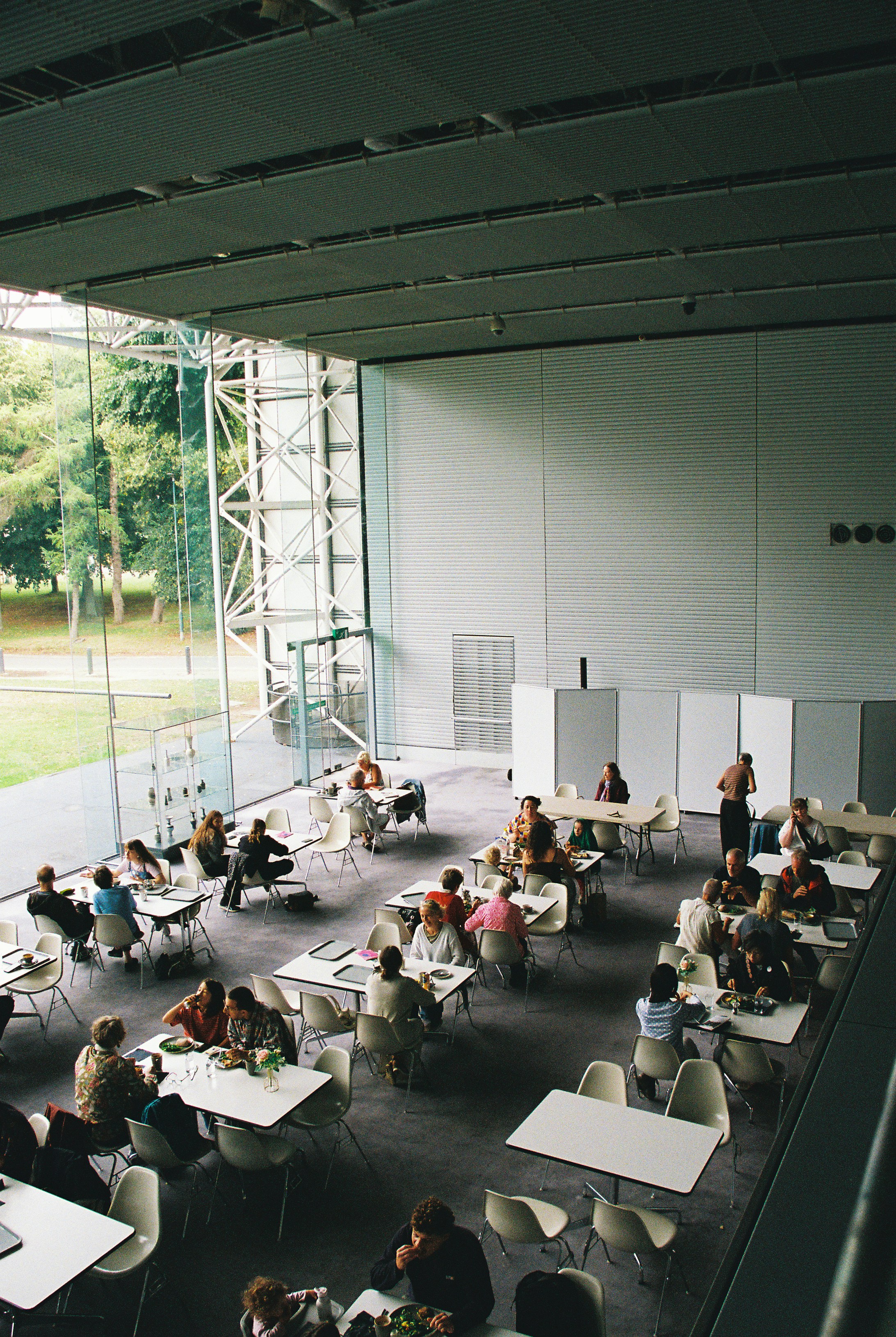 Atrium Dining: Quiet Clusters of Tables in Soft Morning Light