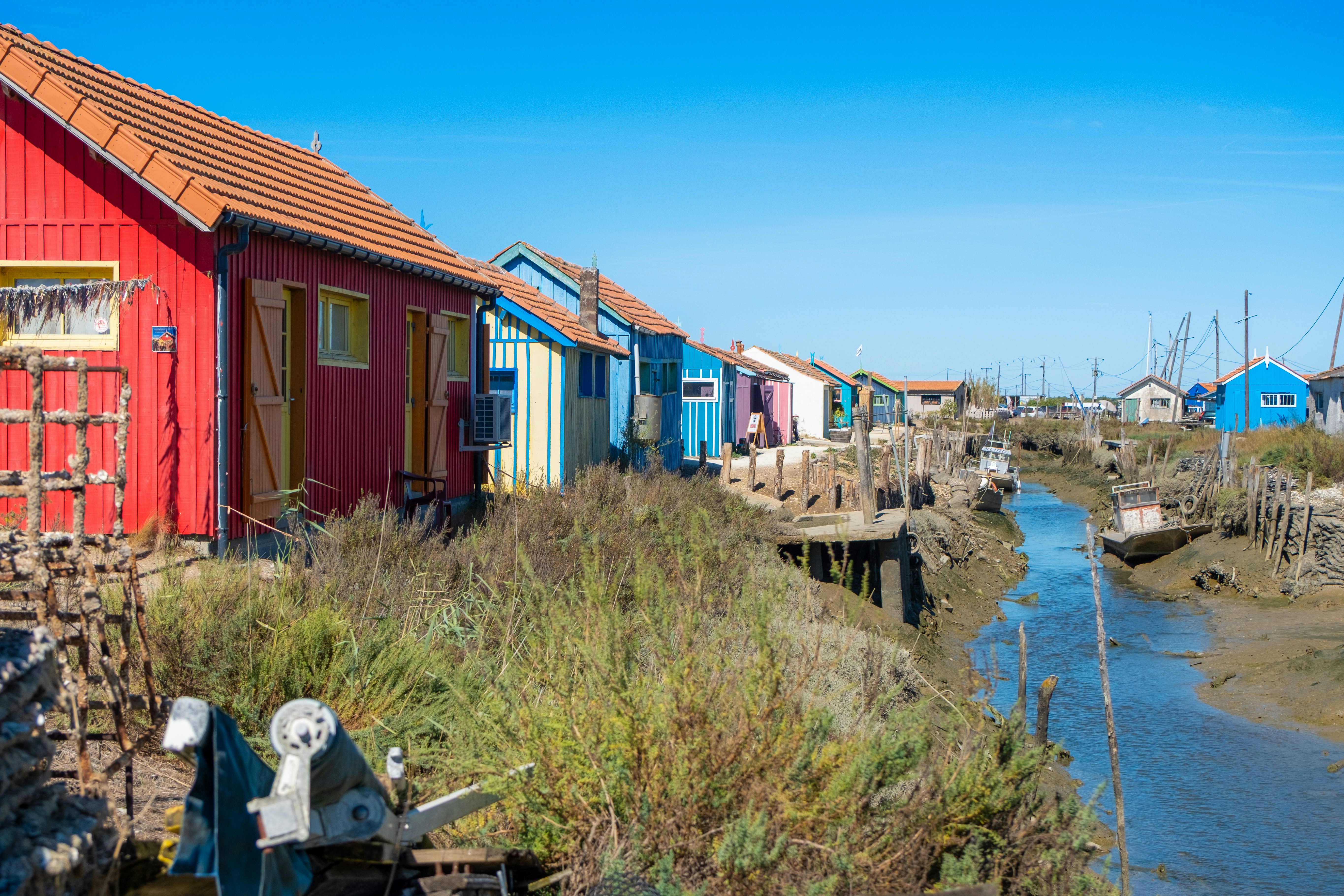 Row of Painted Cottages Along a Channel