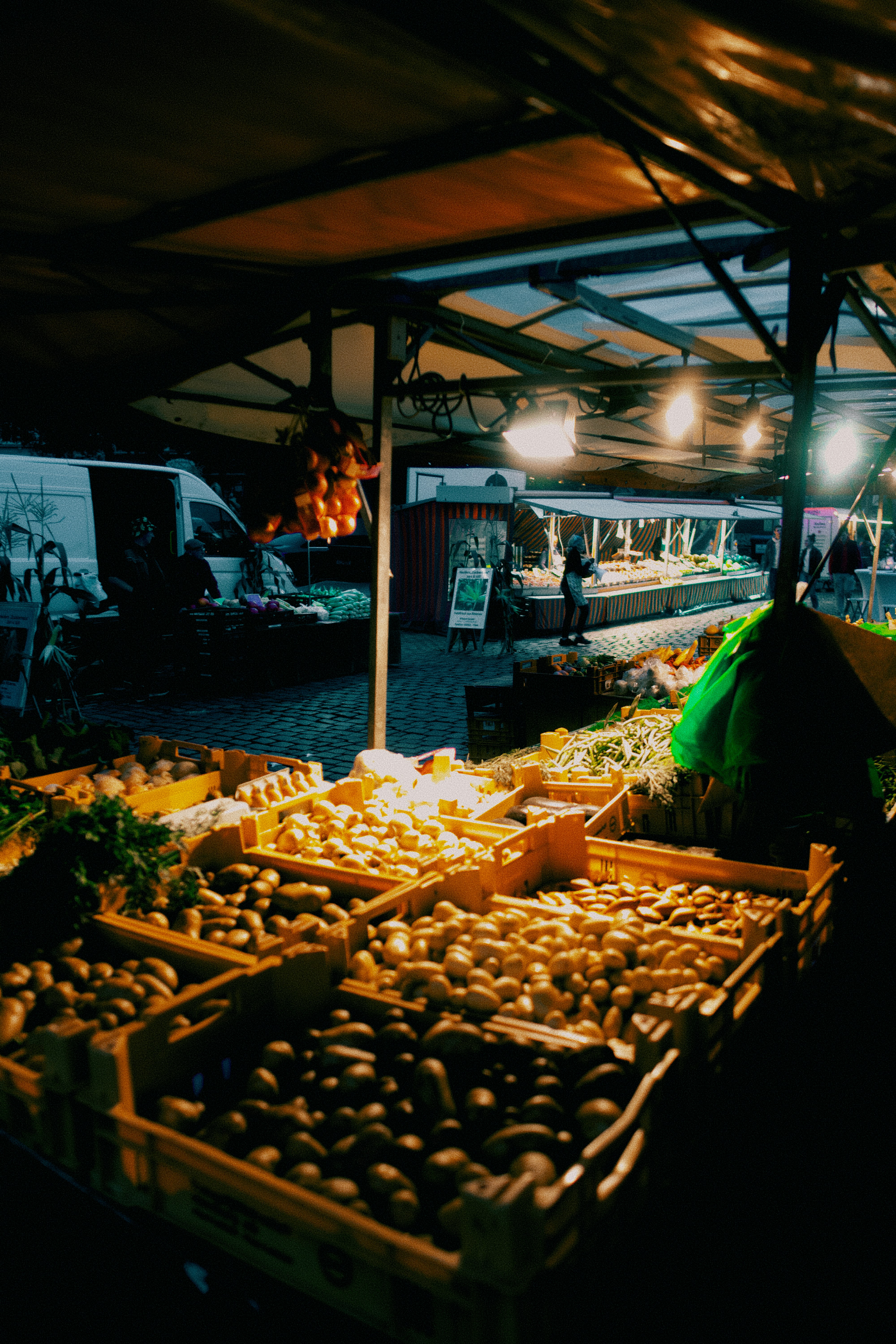 Market Stalls Under Warm Illumination at Dusk