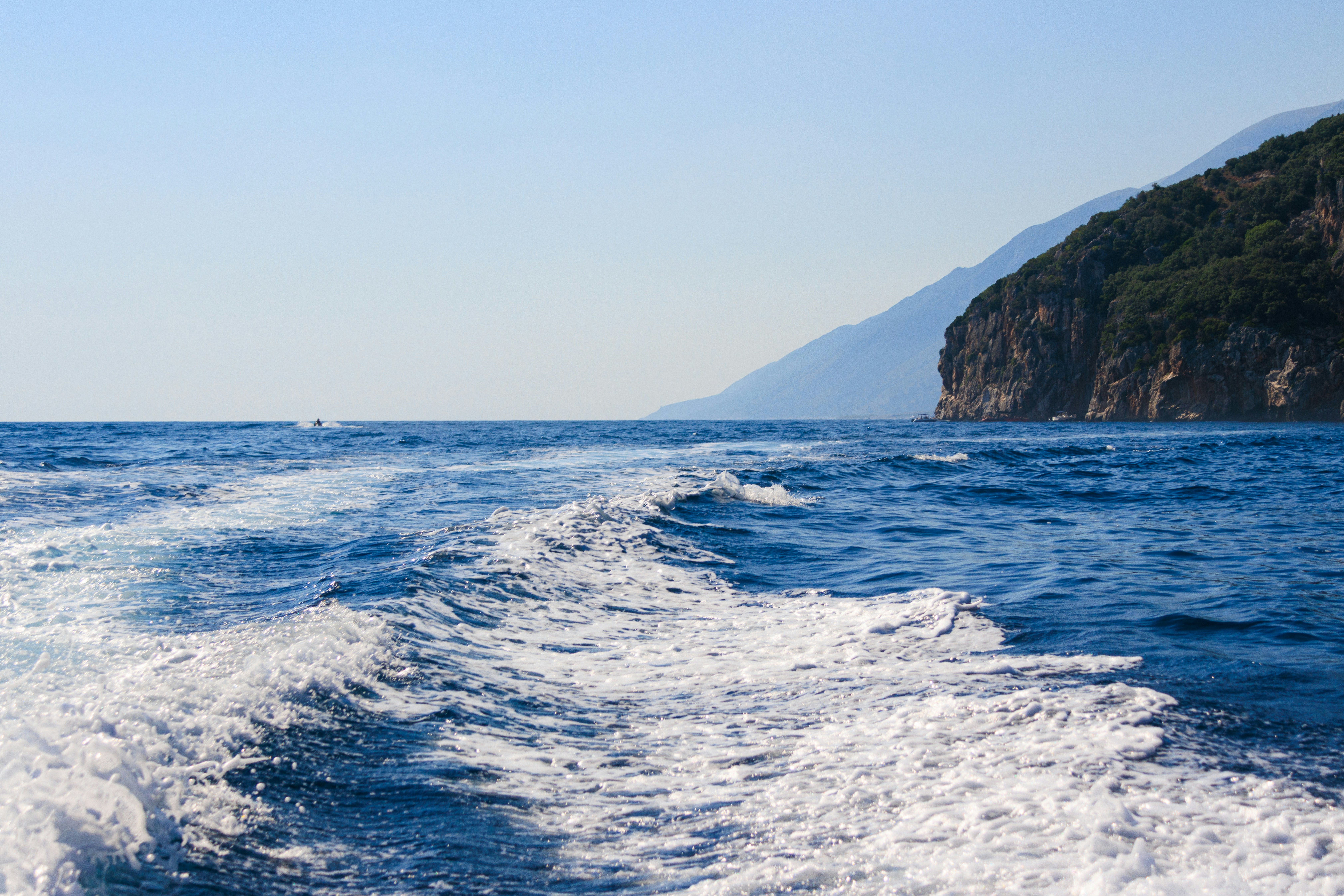 Wake Mark on the Aegean: Ocean Trail Toward the Cliff