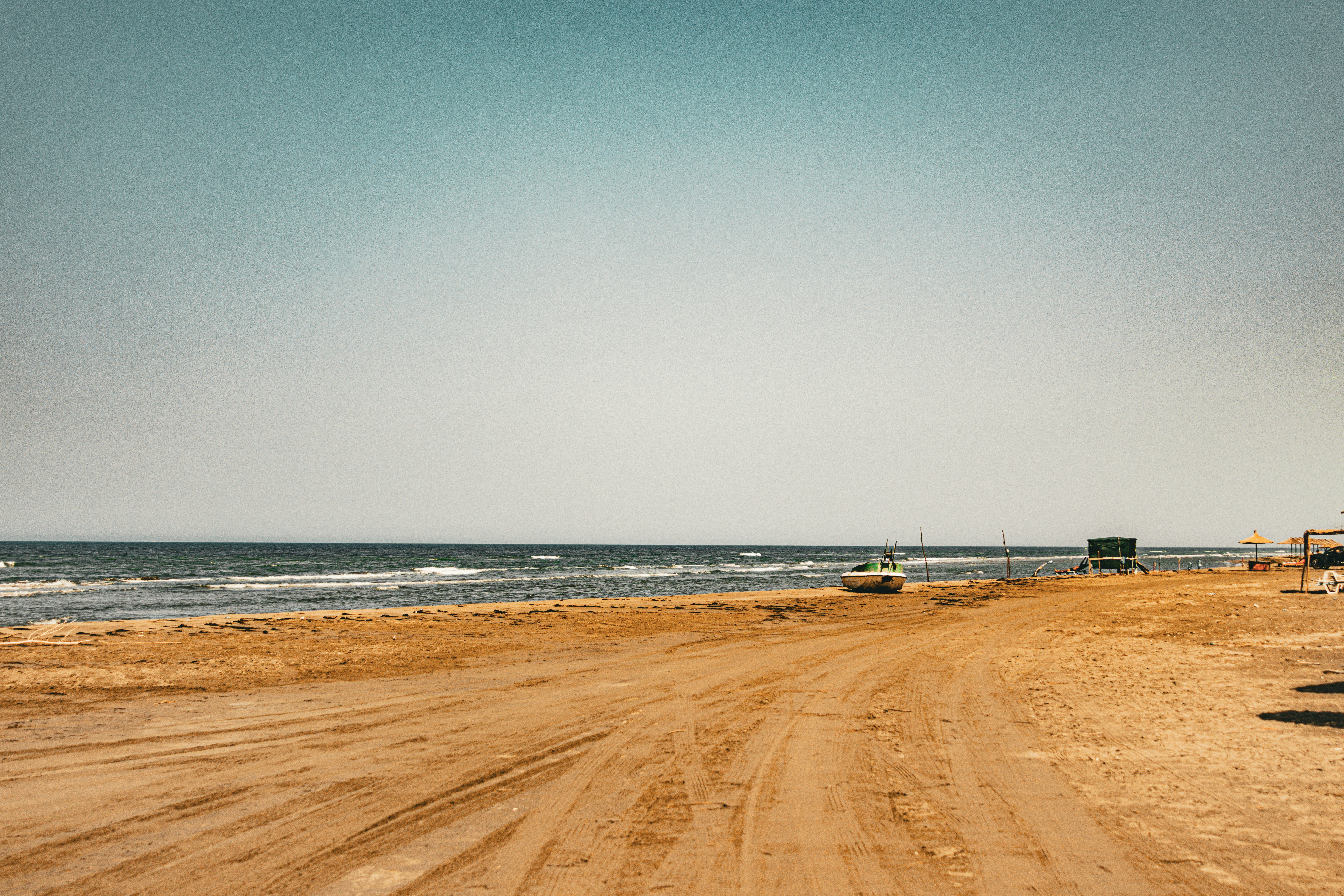 Quiet Beach Road: Tire Tracks to the Sea
