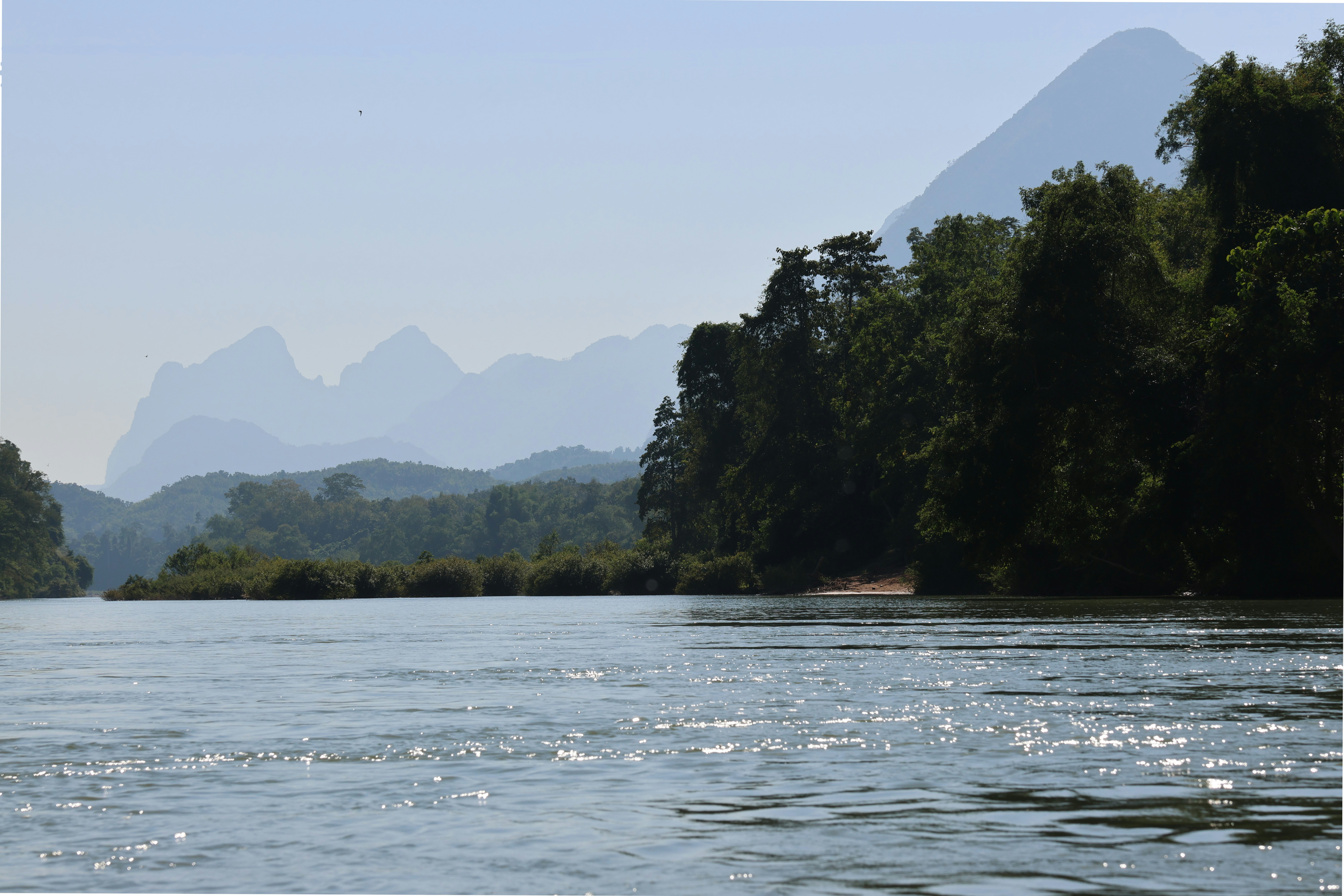 Mist-veiled Peaks over a Quiet River