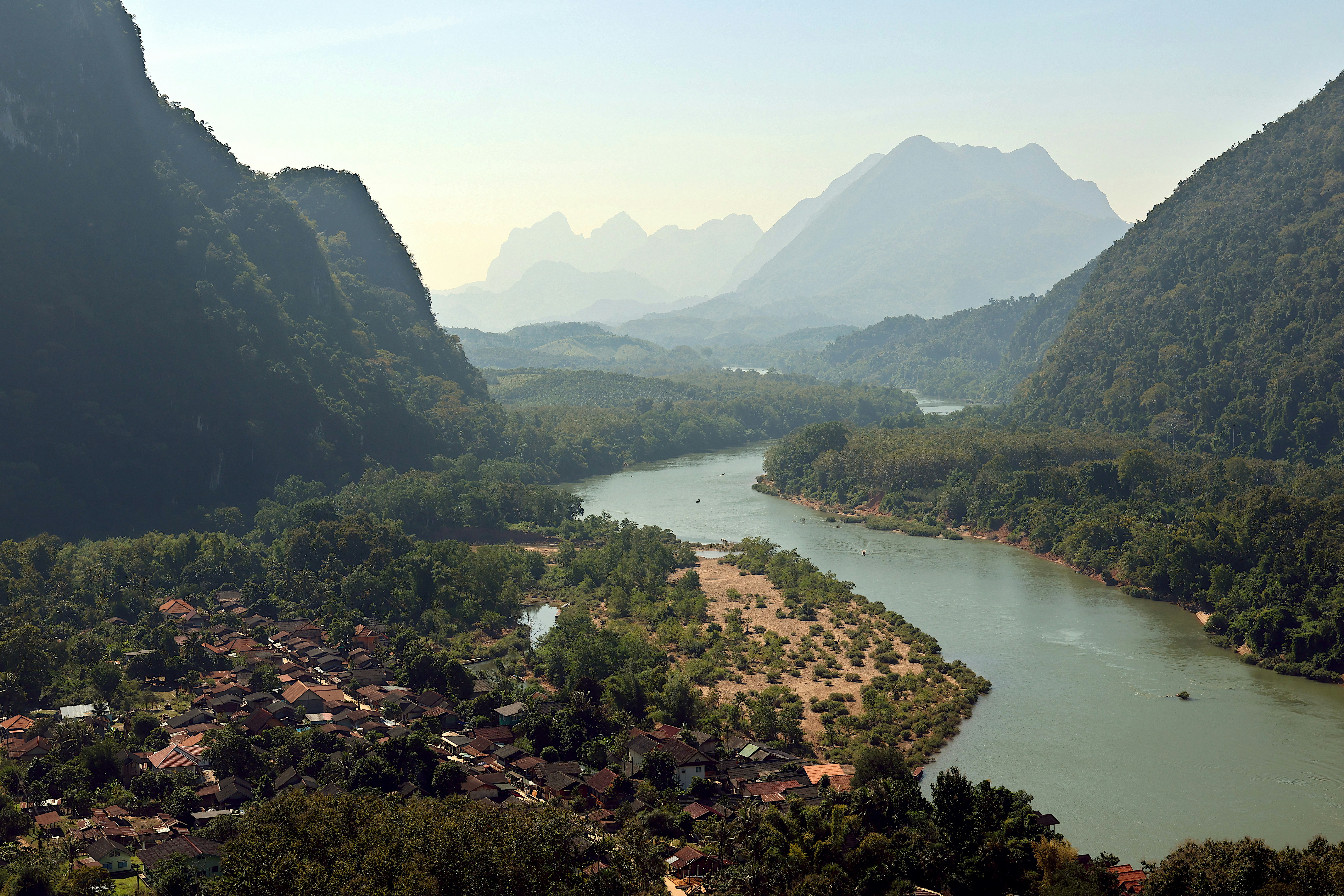 River Valley Confluence Under Pale Mountain Rims