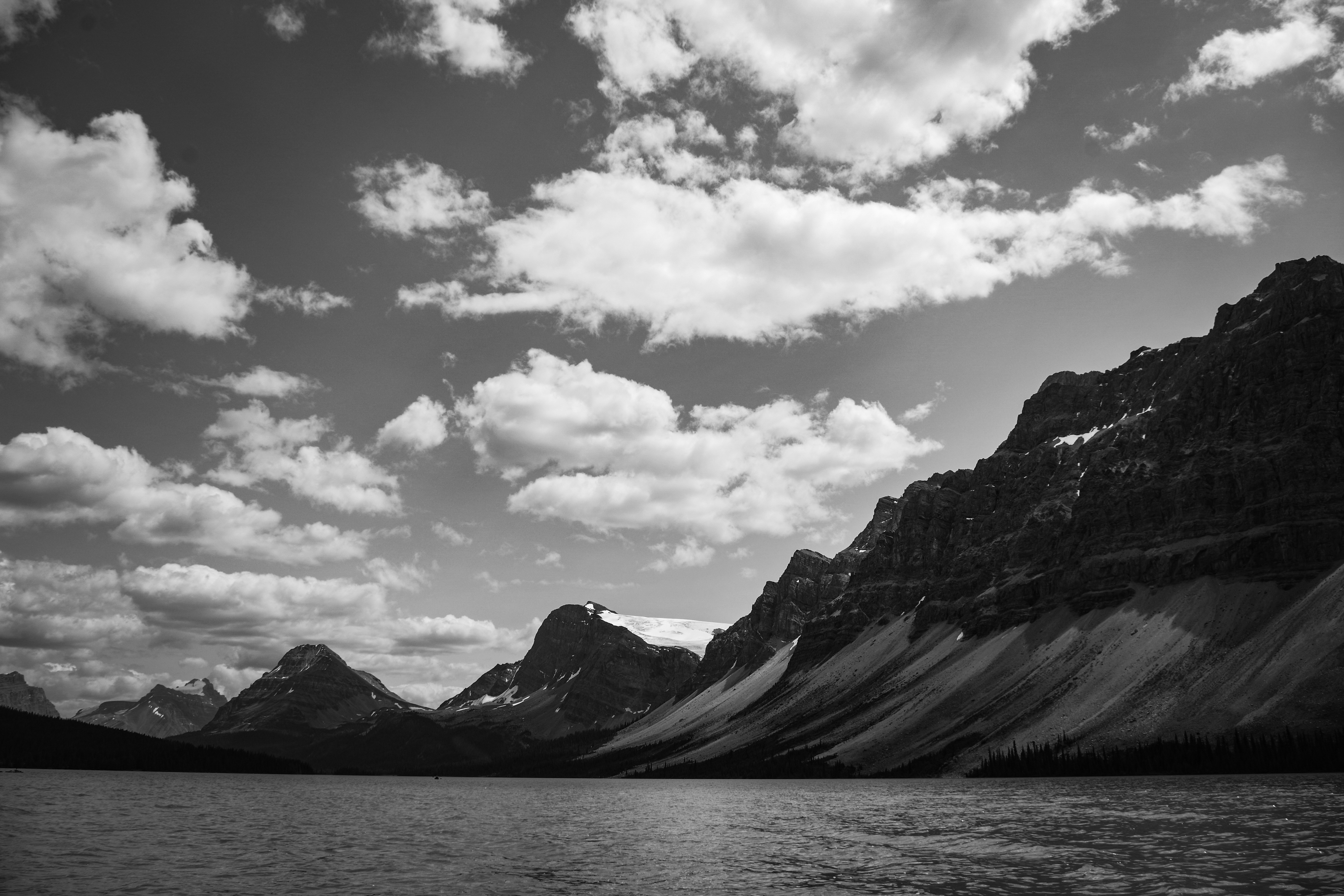 Monolithic Peaks at Dusk over a Quiet Fjord