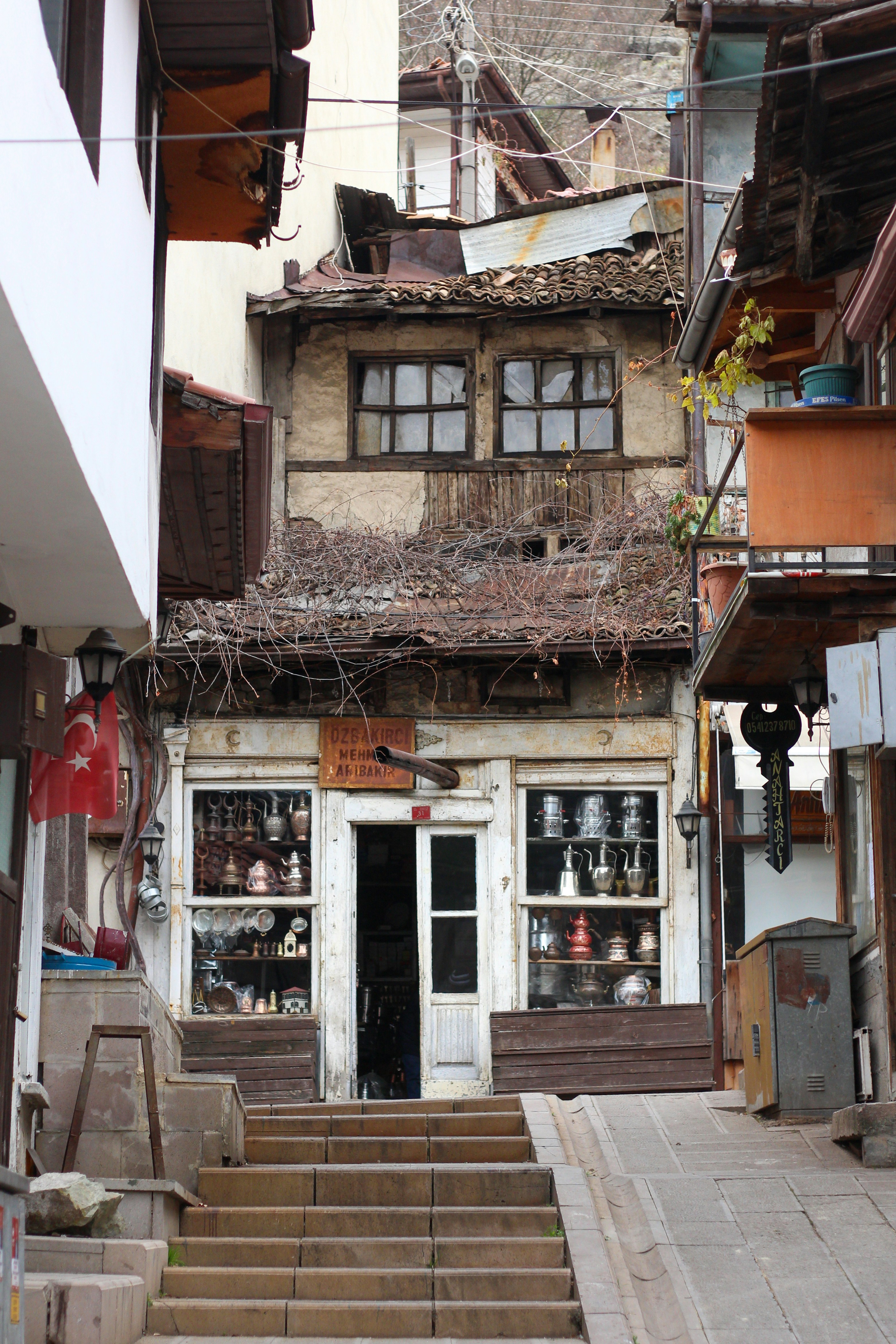 Old-town Shopfront Beneath Weathered Windows