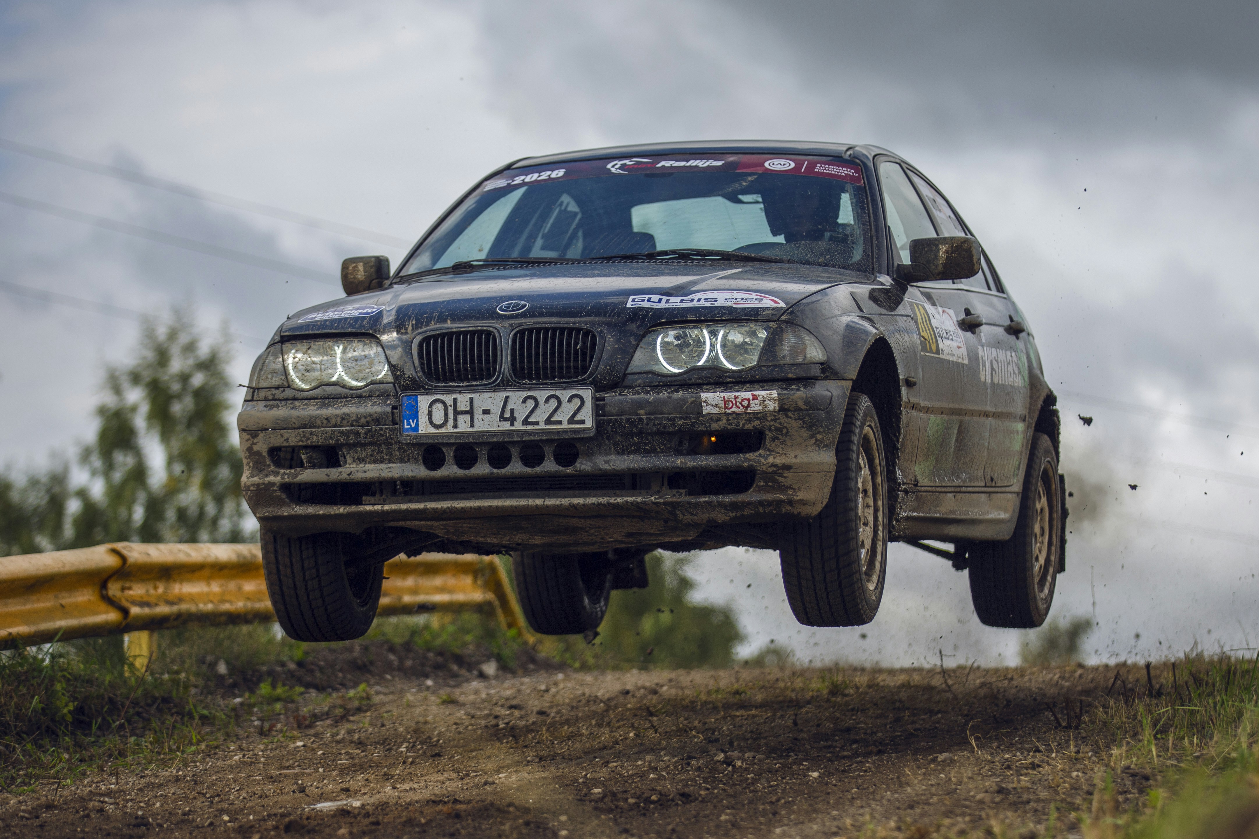 Mid-Air Rally: A Mud-Splashed Coupe Defies Gravity