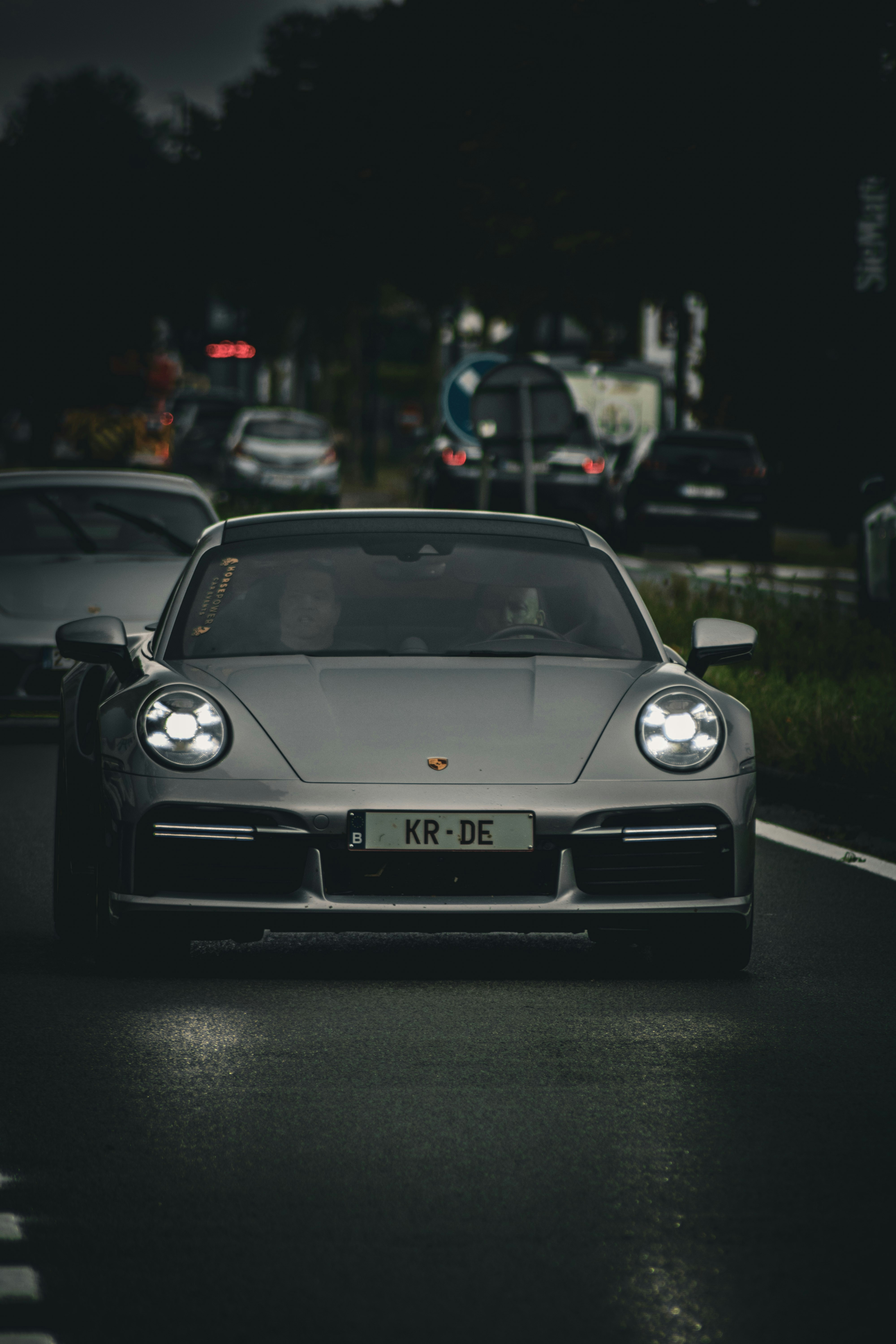 Midnight Drive: A Silver Porsche Leading the Line