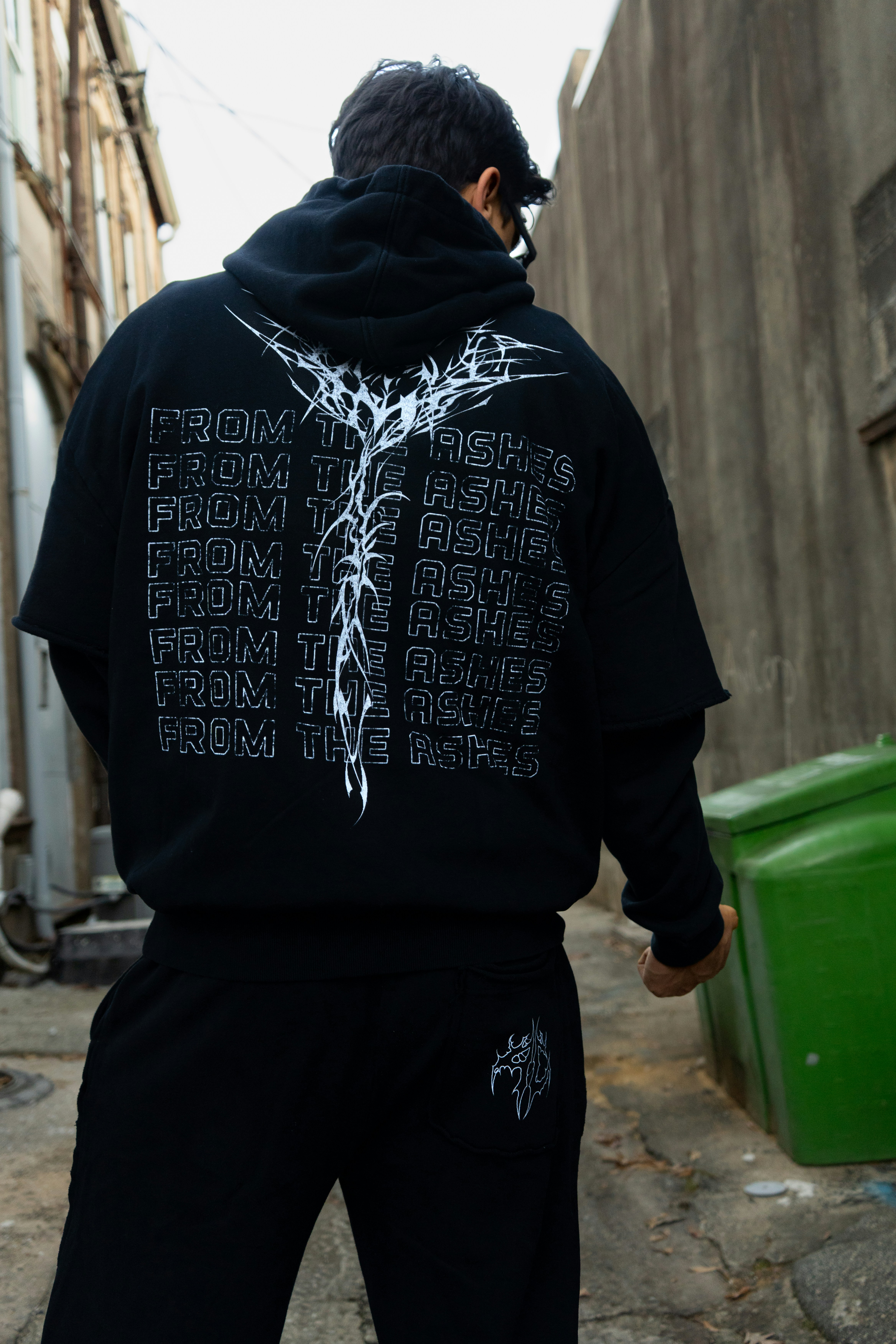 Backlit Alley Portrait in Graphic Streetwear