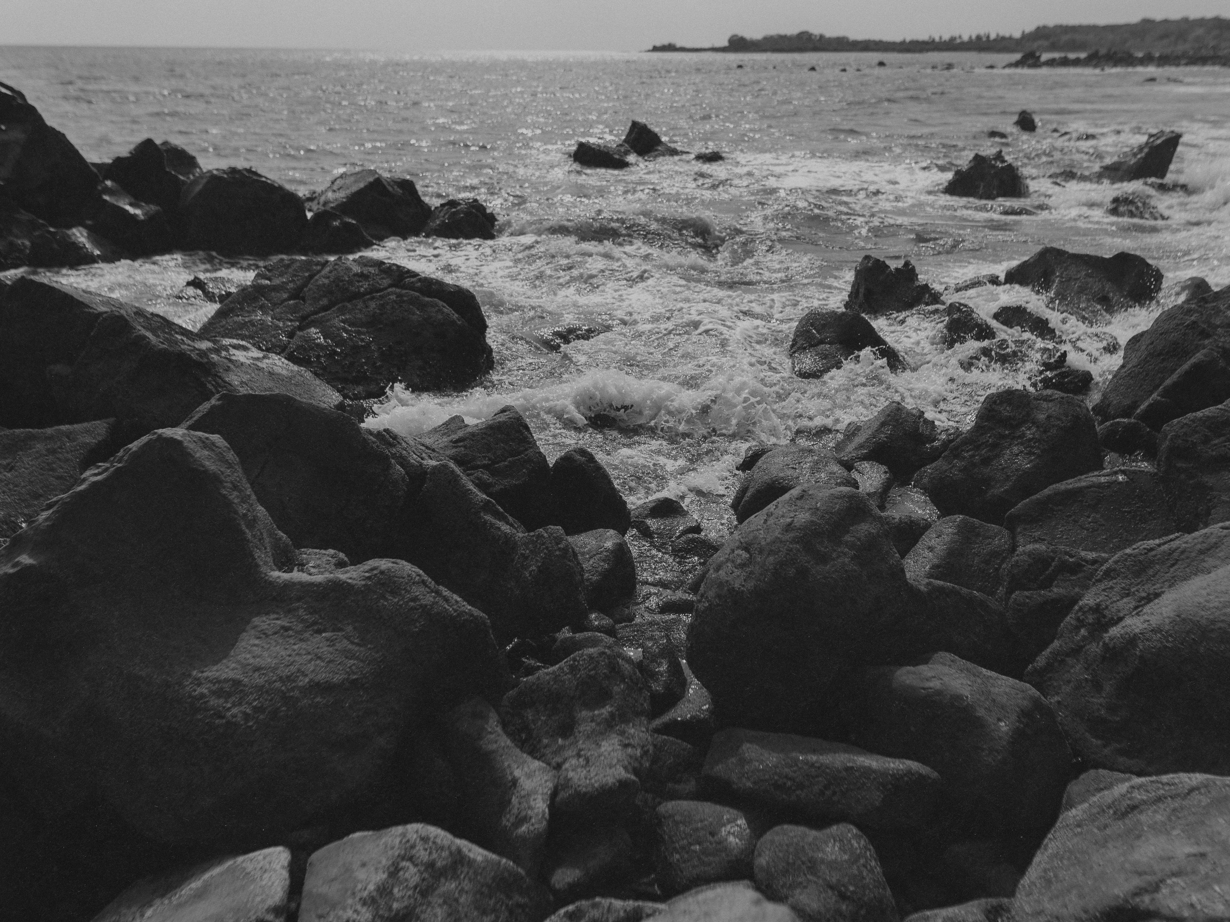 Rugged Tide: Moonlit Rocks Guard the Quiet Sea