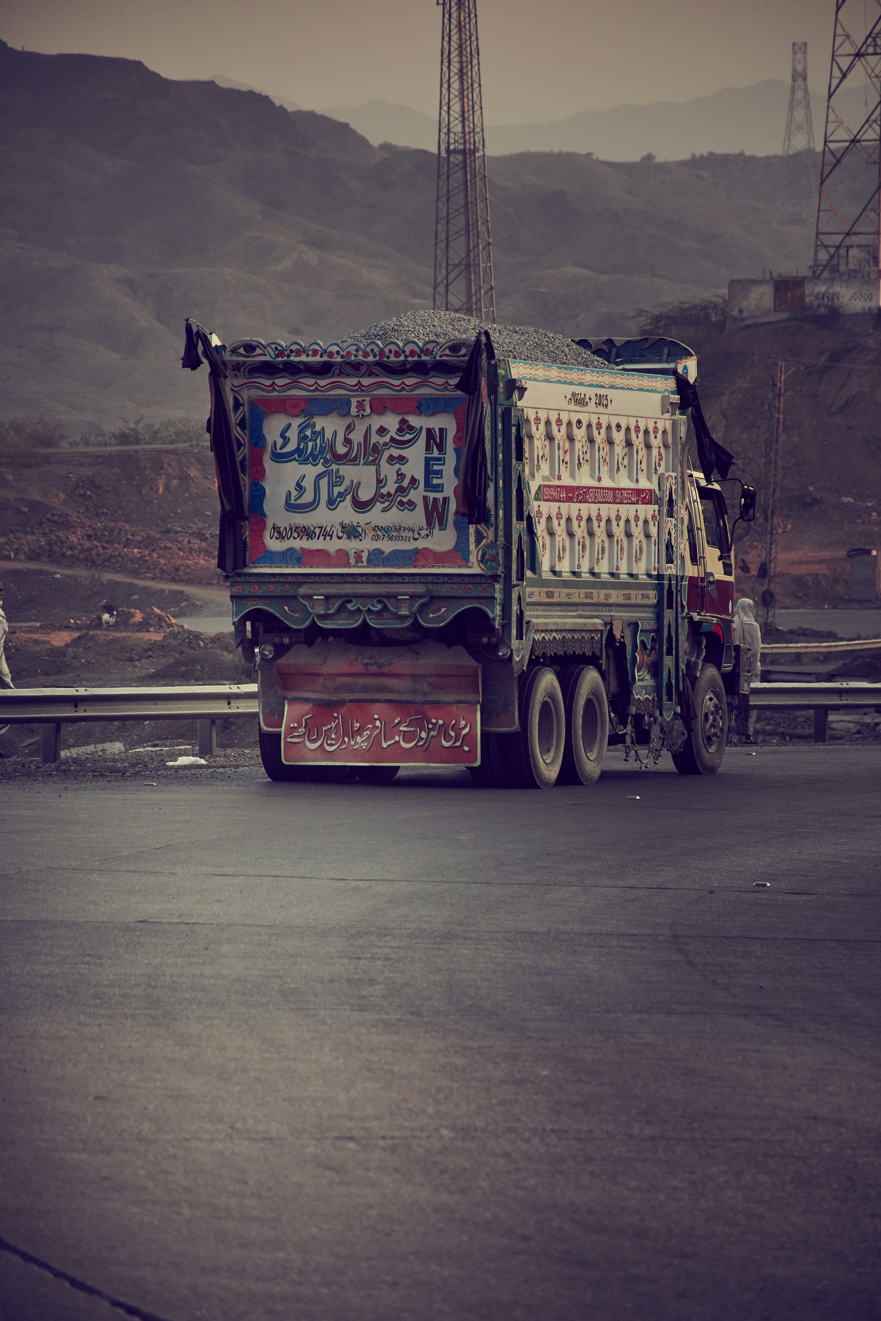 Truck of Color and Dust at the Mountain Bend