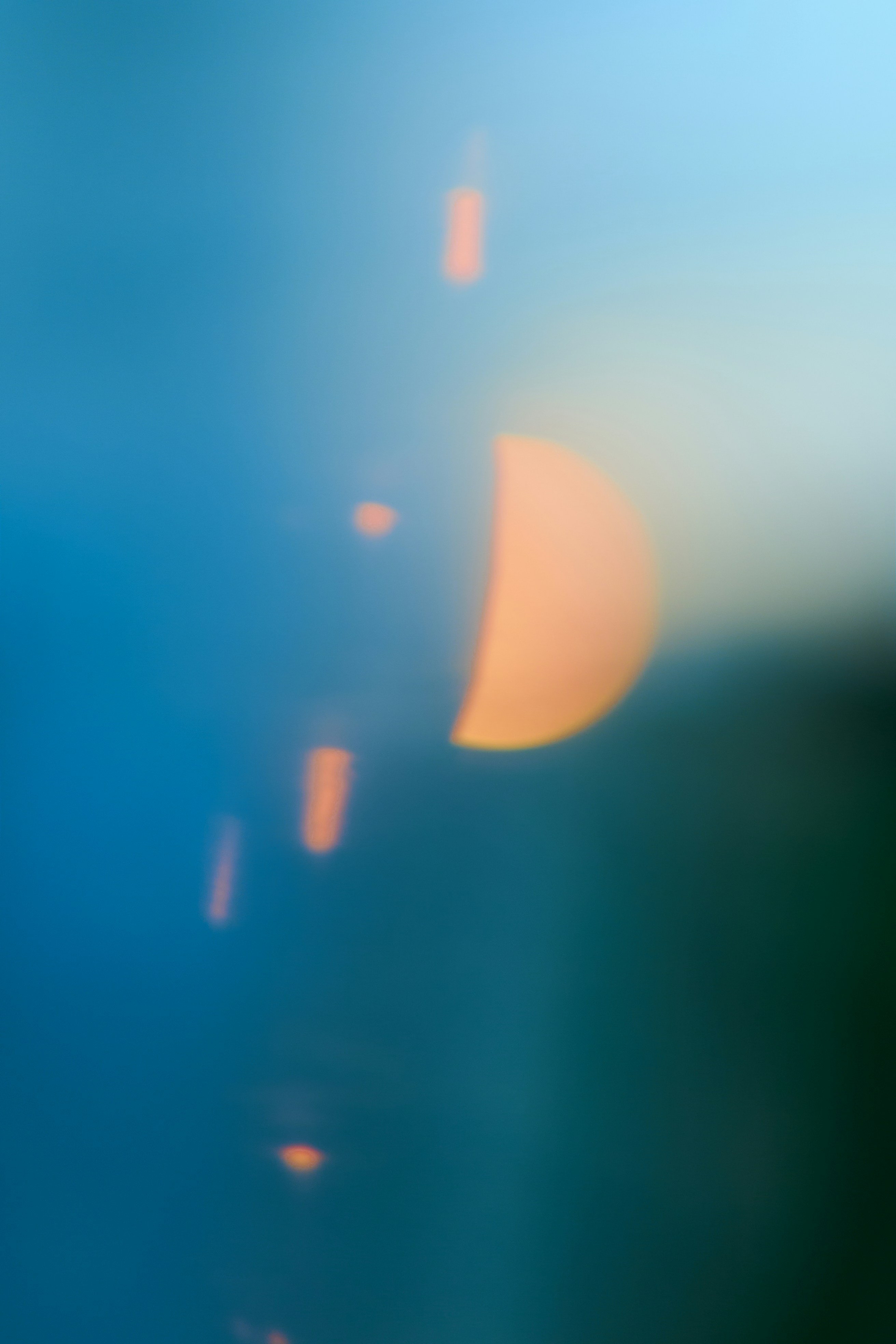 Soft Lunar Glass: Abstract Light Through a Sunset Mist