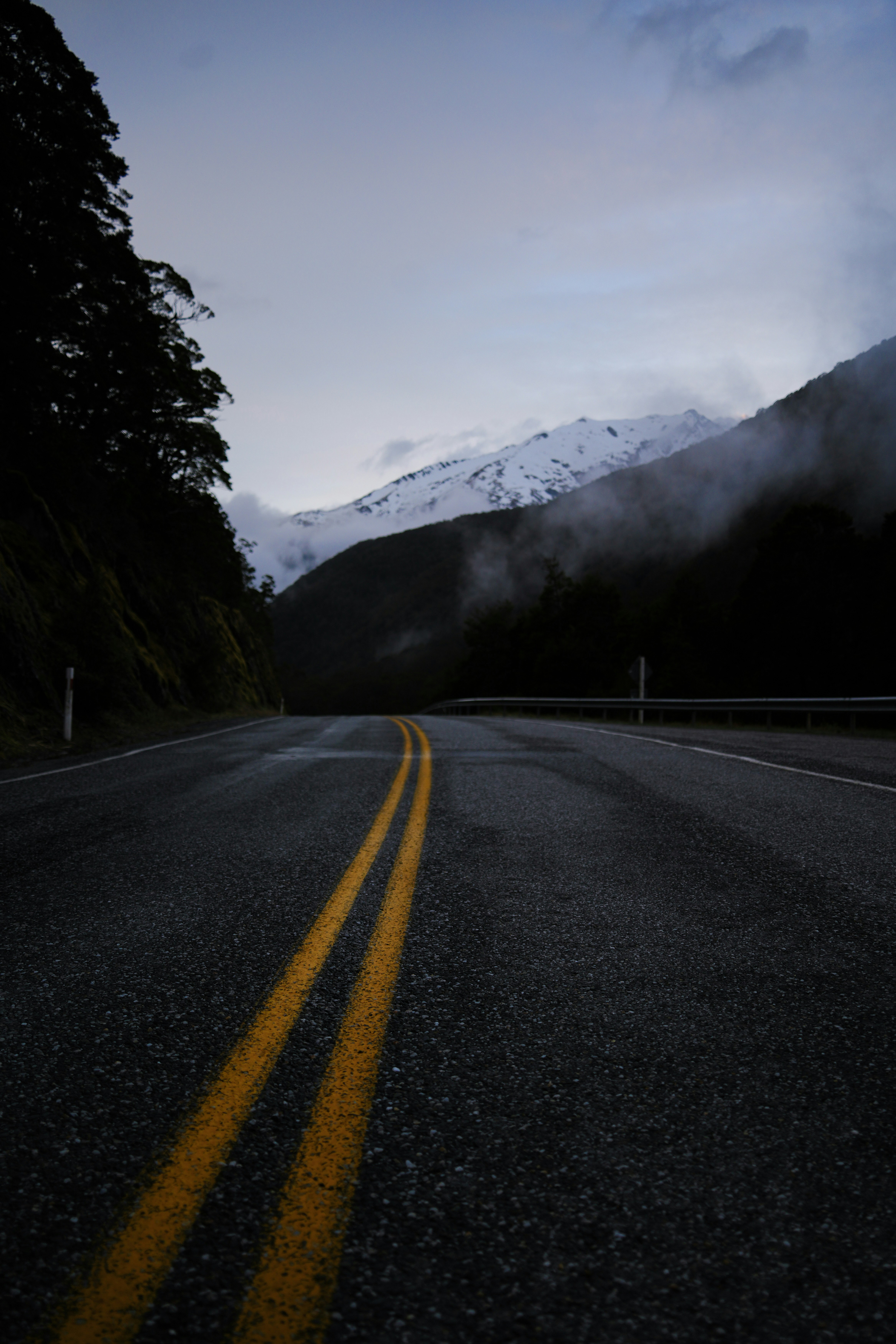 Rain-washed Alpine Highway Toward Clouded Peaks