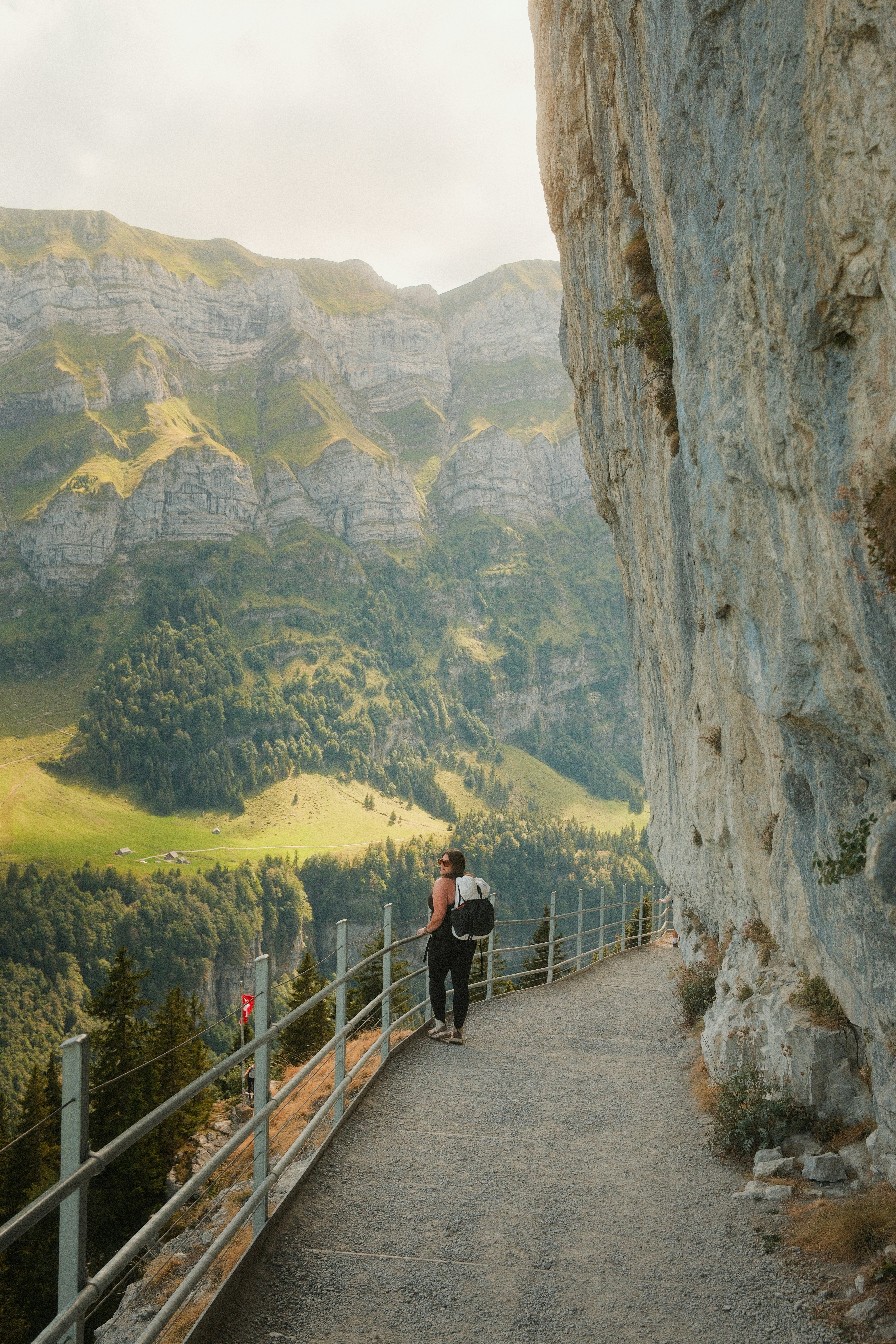 Trail toward the cliffside overlook under a pale morning sky