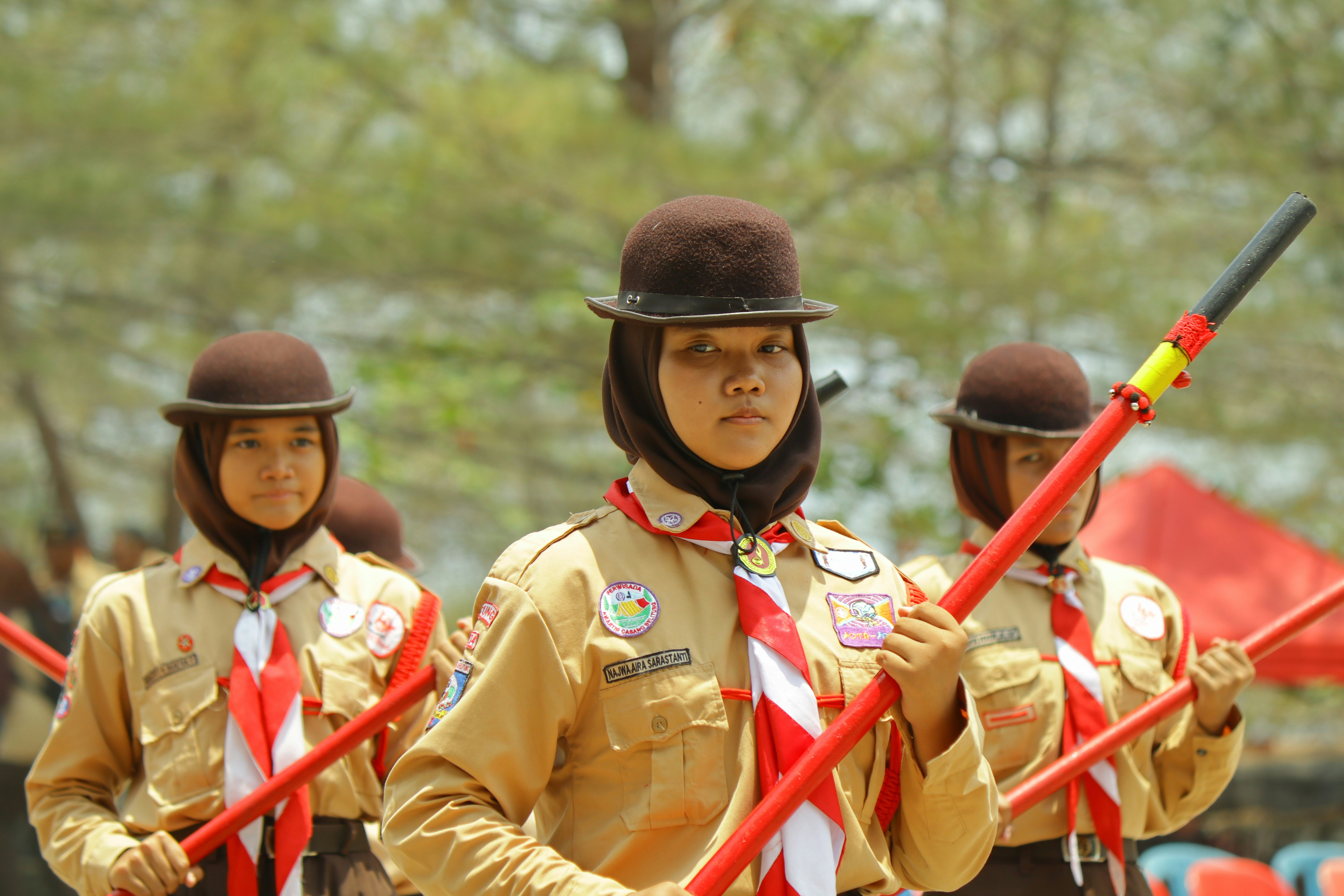 Center Stage in Uniform: Parade Leader with Flag Baton