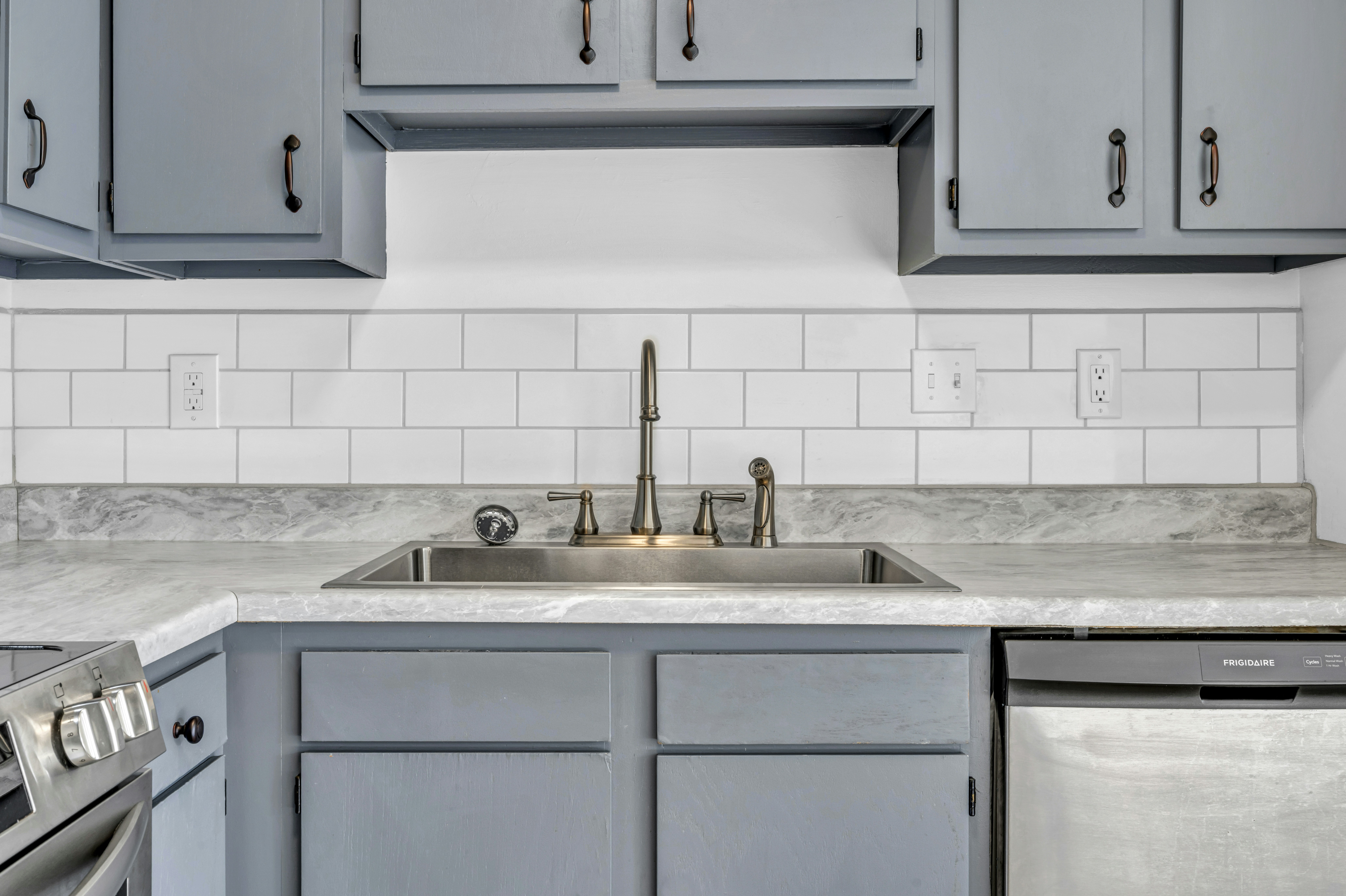 Minimalist Kitchen Sink Portrait Under Soft Perimeter Light