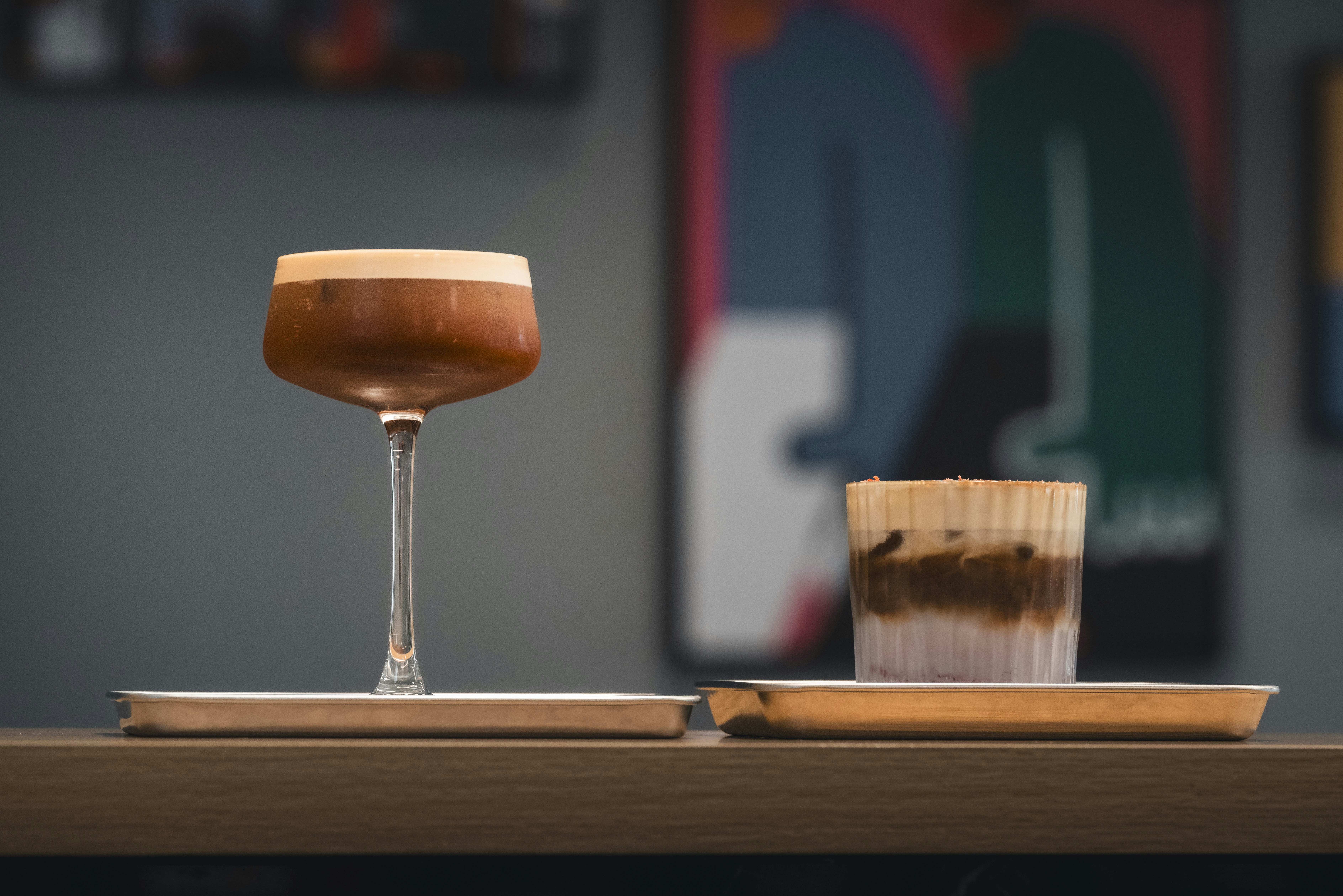 Two-Tone Treats at the Bar: A Pair of Glasses on a Wooden Counter