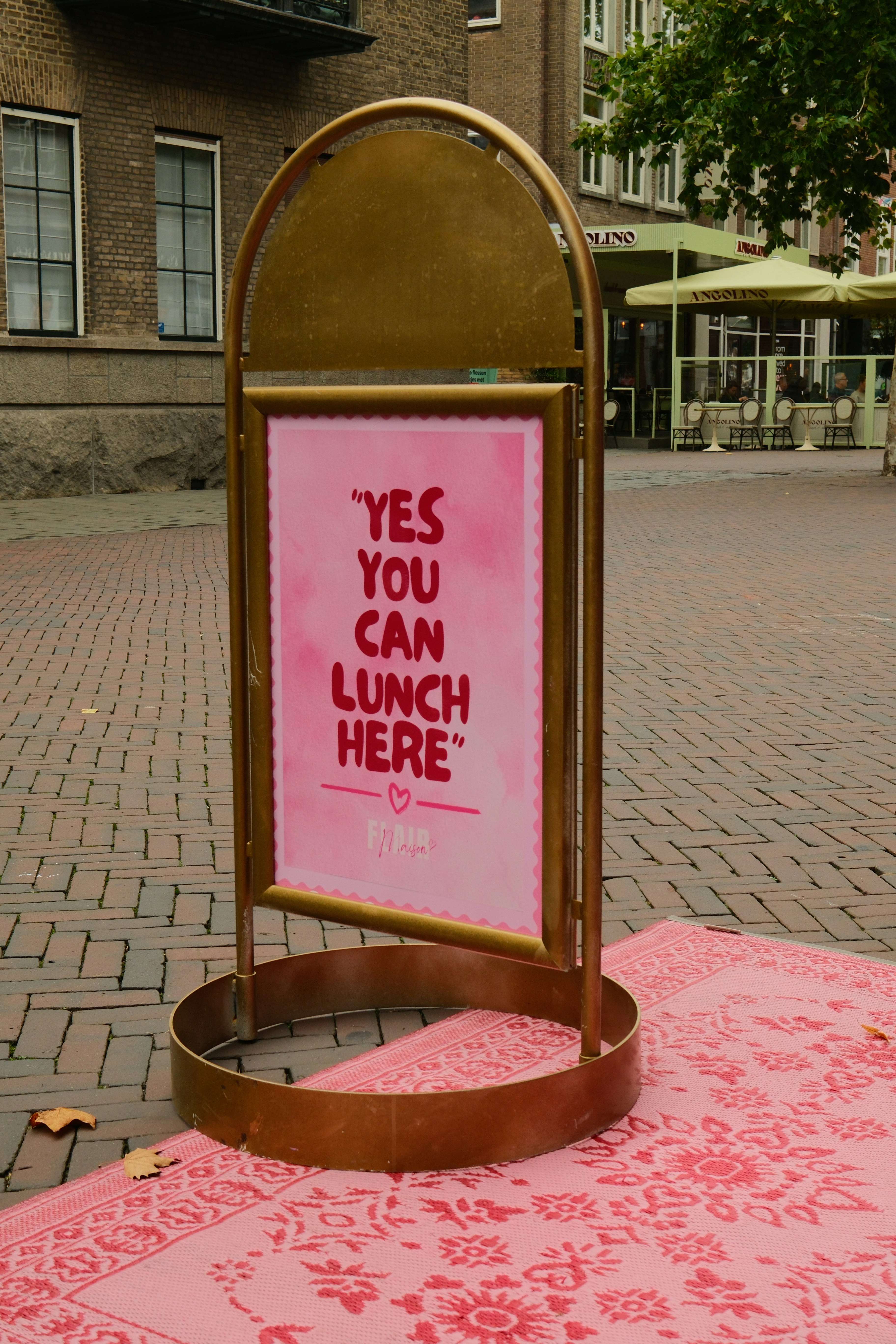 Yes You Can Lunch Here: A Pink Sign on a Quiet City Escape