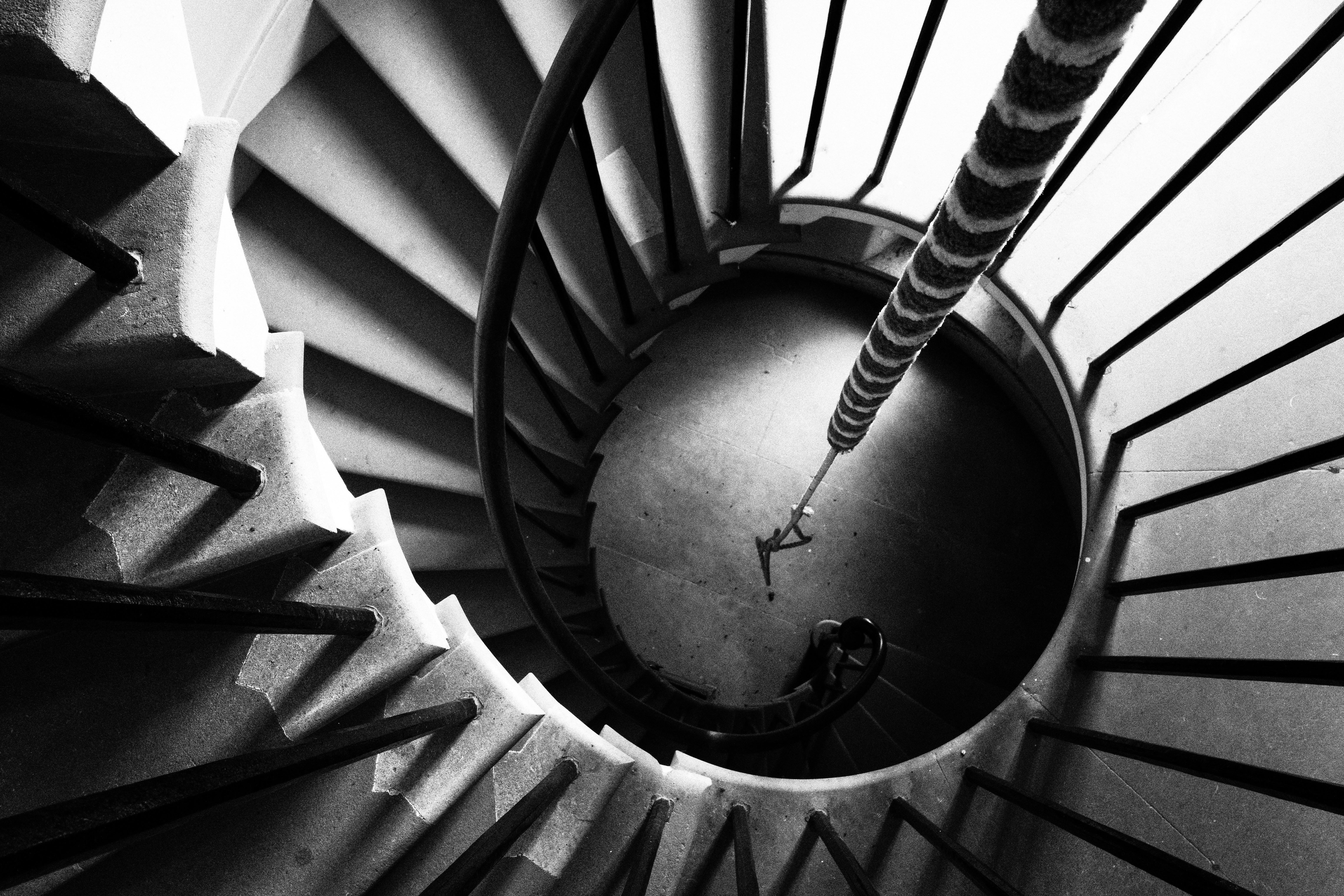 Spiral Descent: A Monochrome Coil of Staircase Silence